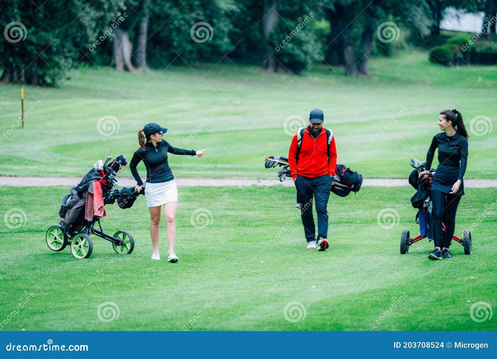 Golf Training. Two Young Ladies with Golf Instructor Having a Lesson on ...