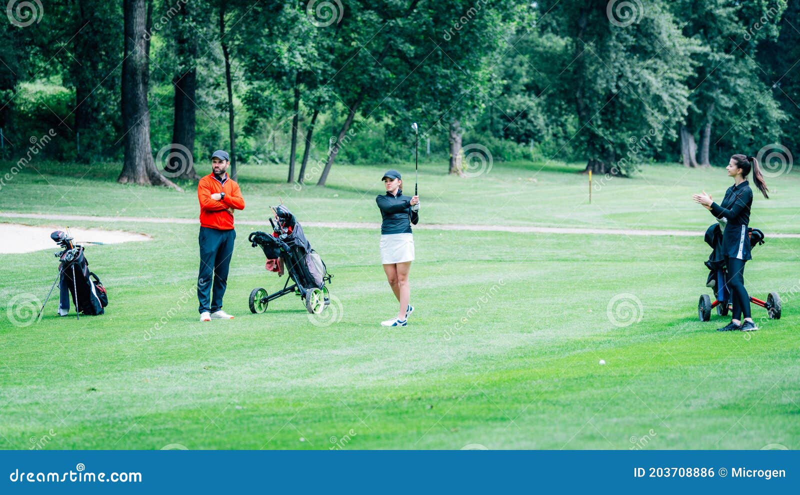 Golf Training. Two Young Ladies with Golf Instructor Having a Lesson on ...