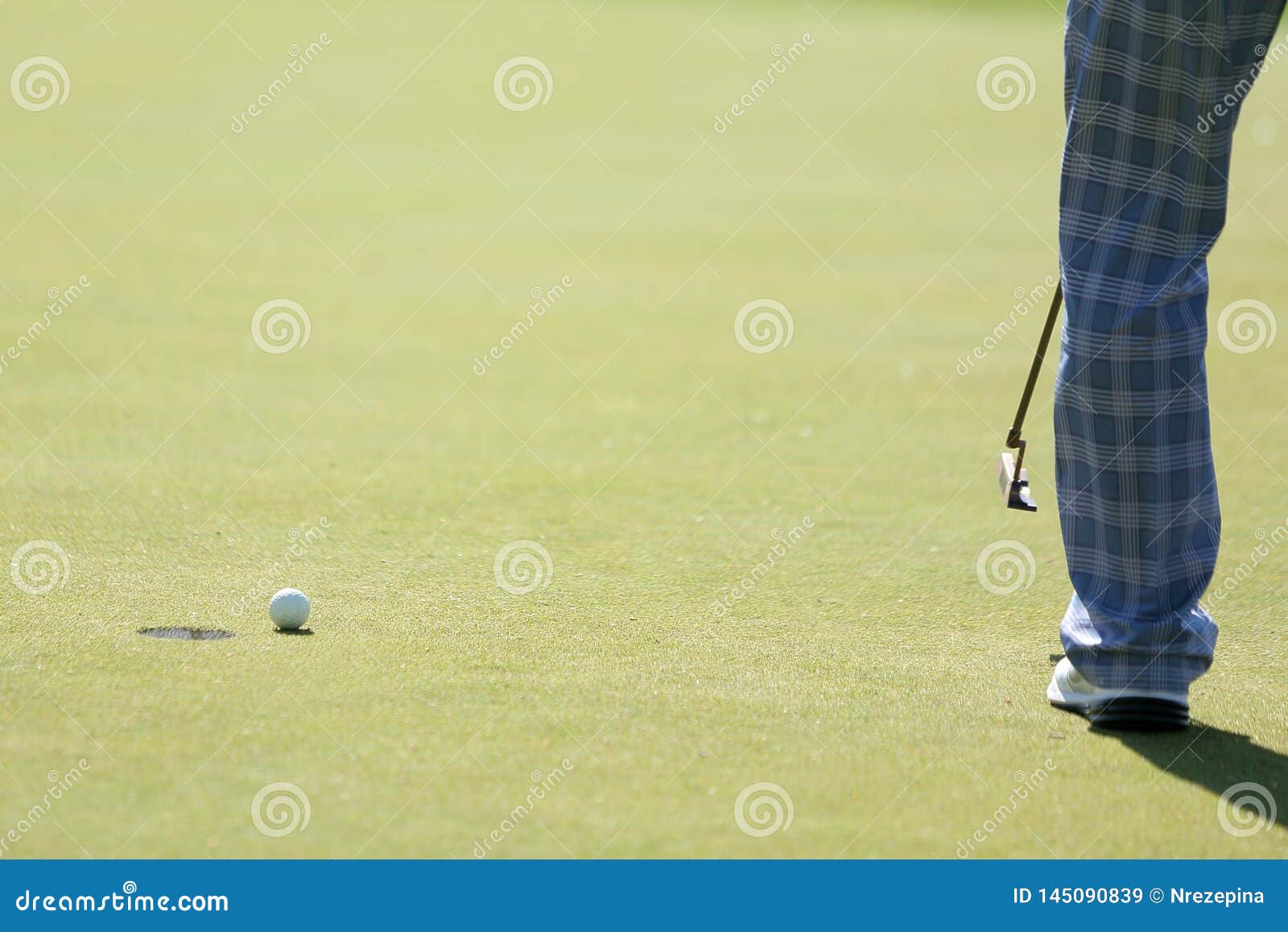 A Golfer Does the Putting To a Hole Stock Image - Image of golfcar ...