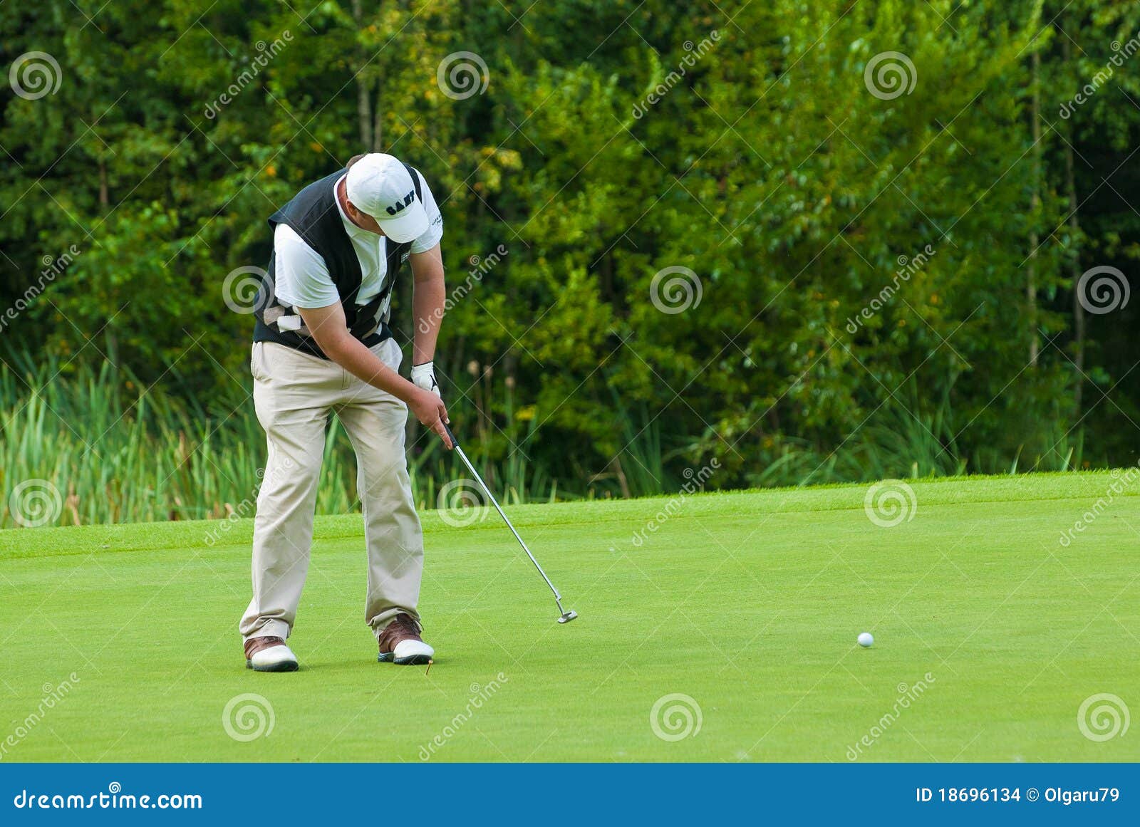 Golfer finishes his swing editorial stock image. Image of boomers ...