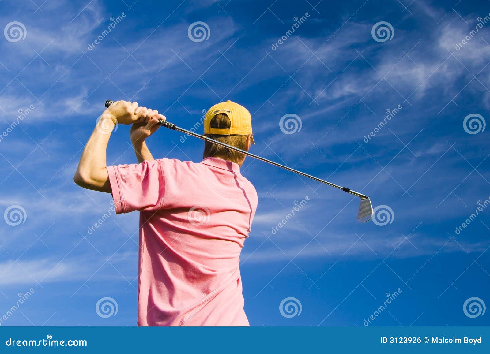 Golfer finishing his swing stock photo. Image of golf - 3123926