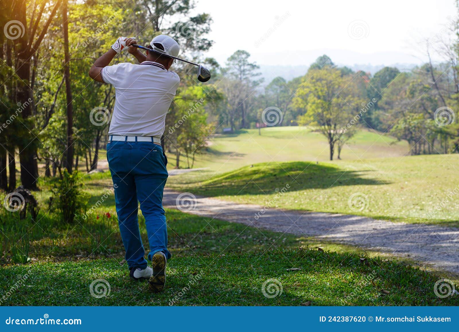 Golfer Playing Golf in the Evening Golf Course, on Sun Set Evening Time ...