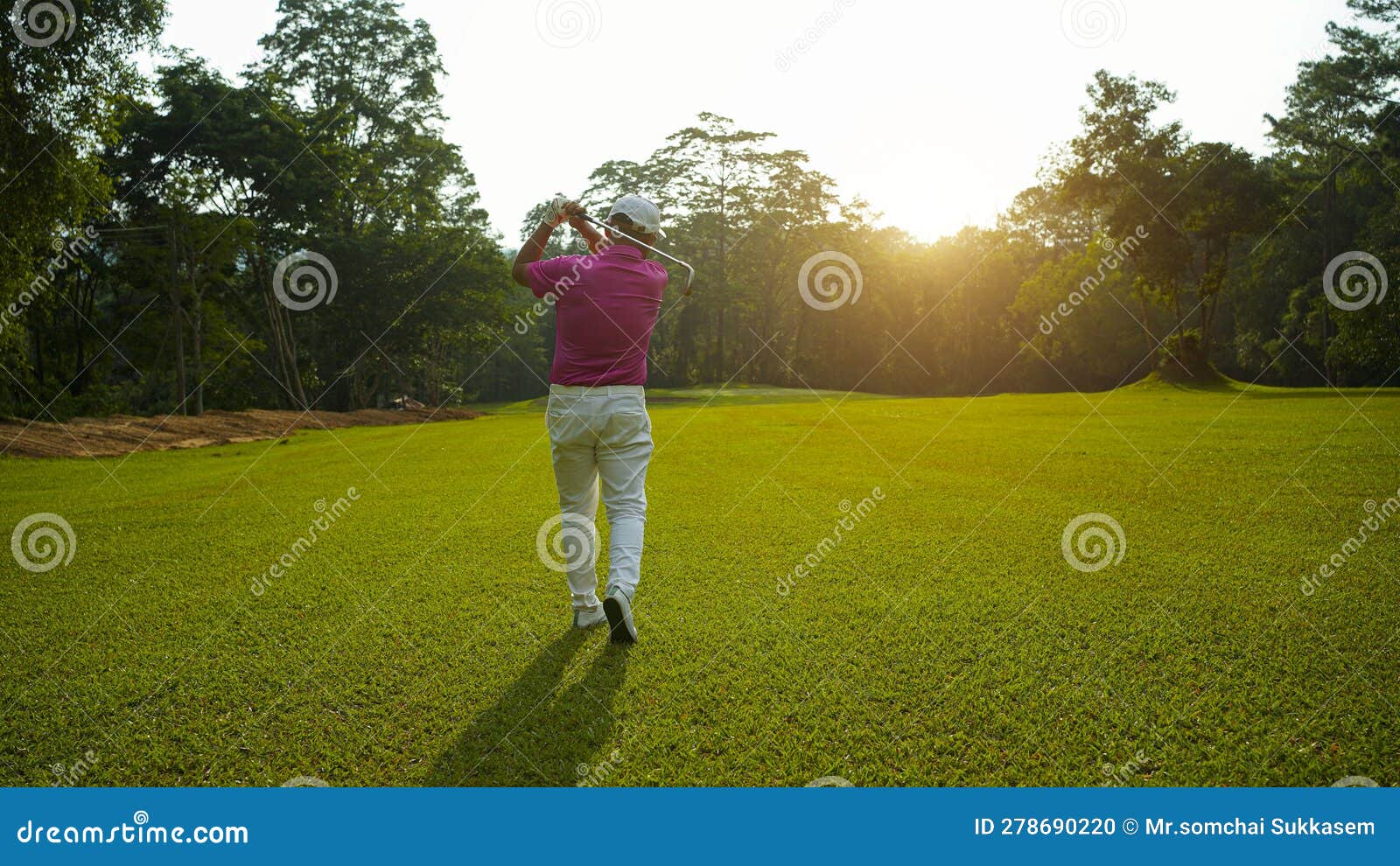 Golfer Playing Golf in the Evening Golf Course, on Sun Set Evening Time ...