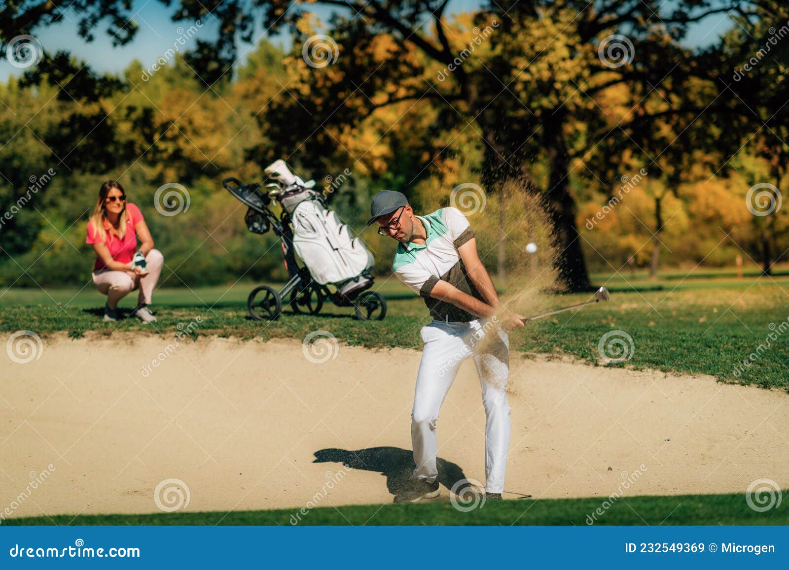 Golfer Playing from the Sand Trap Stock Image - Image of swing, couple ...