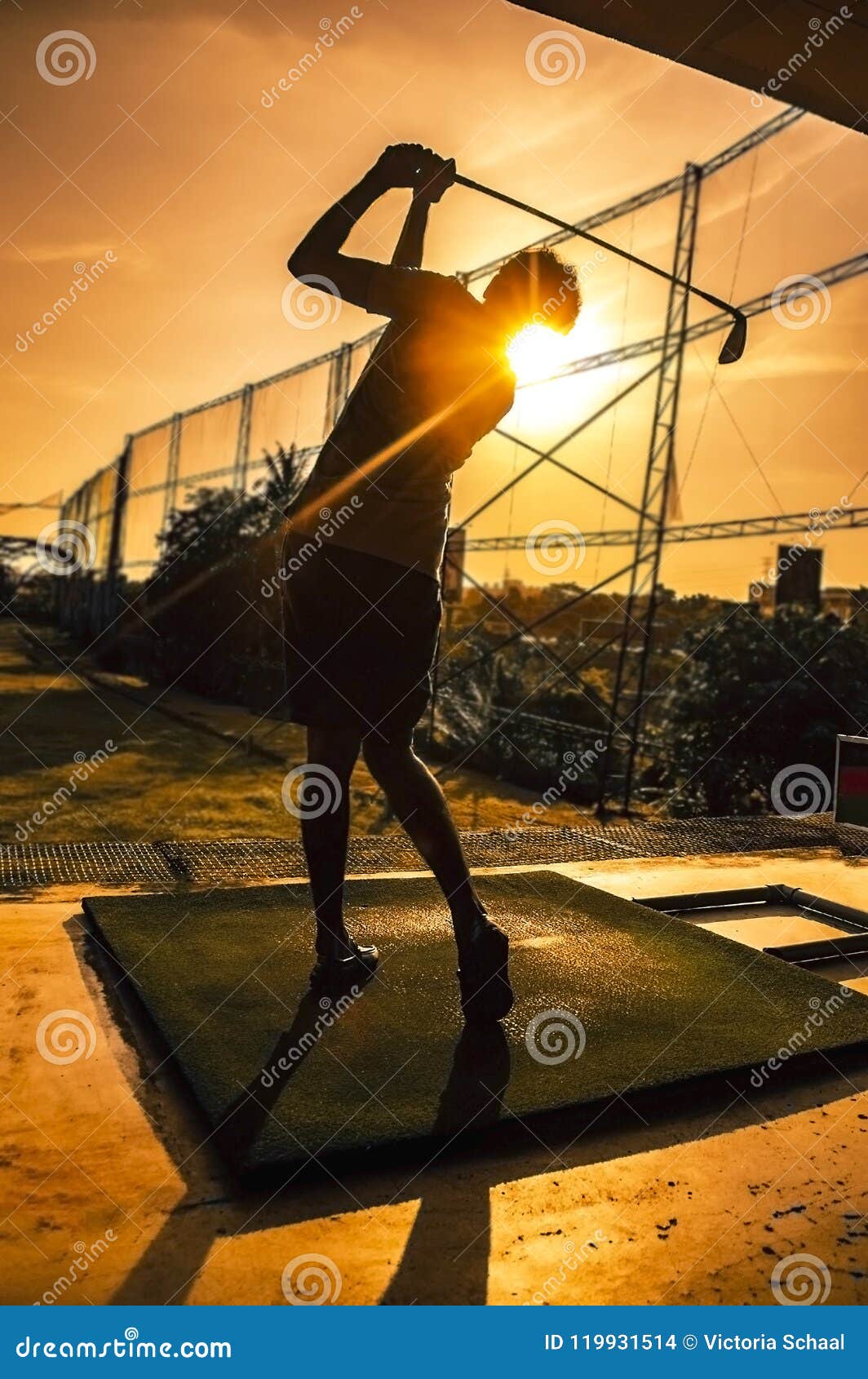 Golfer Swinging in Orange Sunset Stock Photo - Image of golfing ...