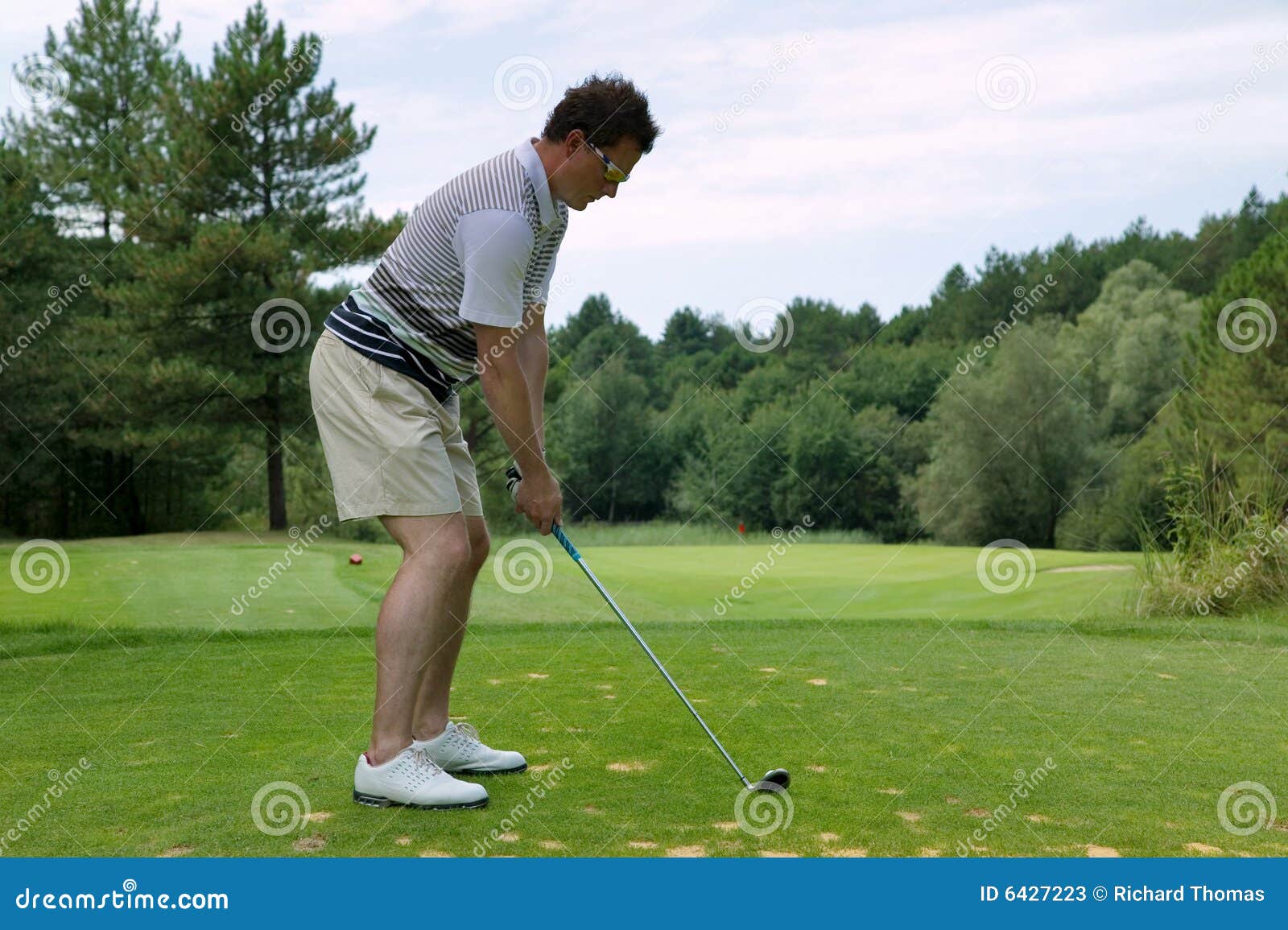 Golfer teeing off stock image. Image of grip, golf, sport - 6427223 Golfer teeing off stock image. Image of grip, golf, sport - 6427223