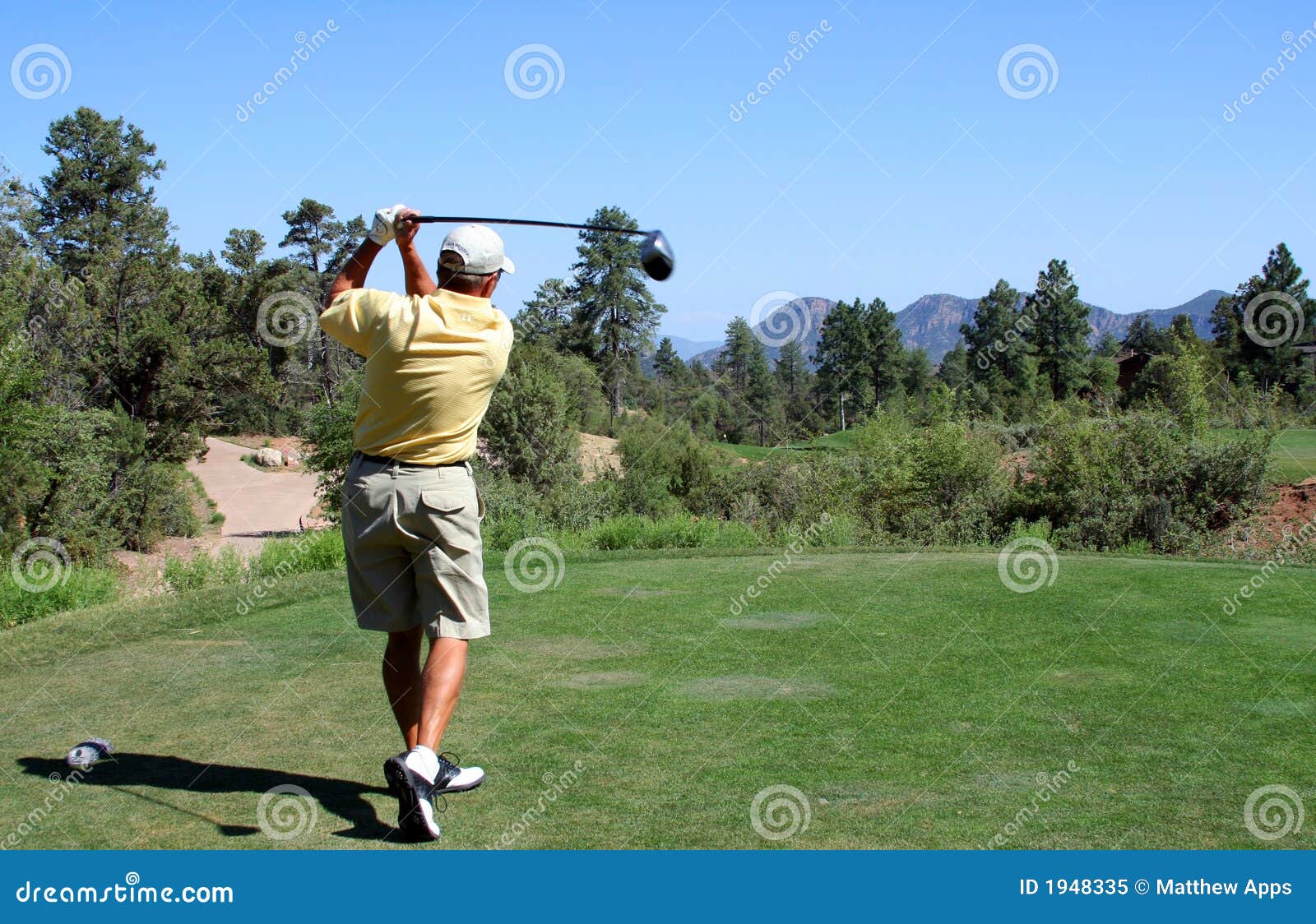 Golfer Teeing Off in the Mountains Stock Image - Image of hazard, eagle ...