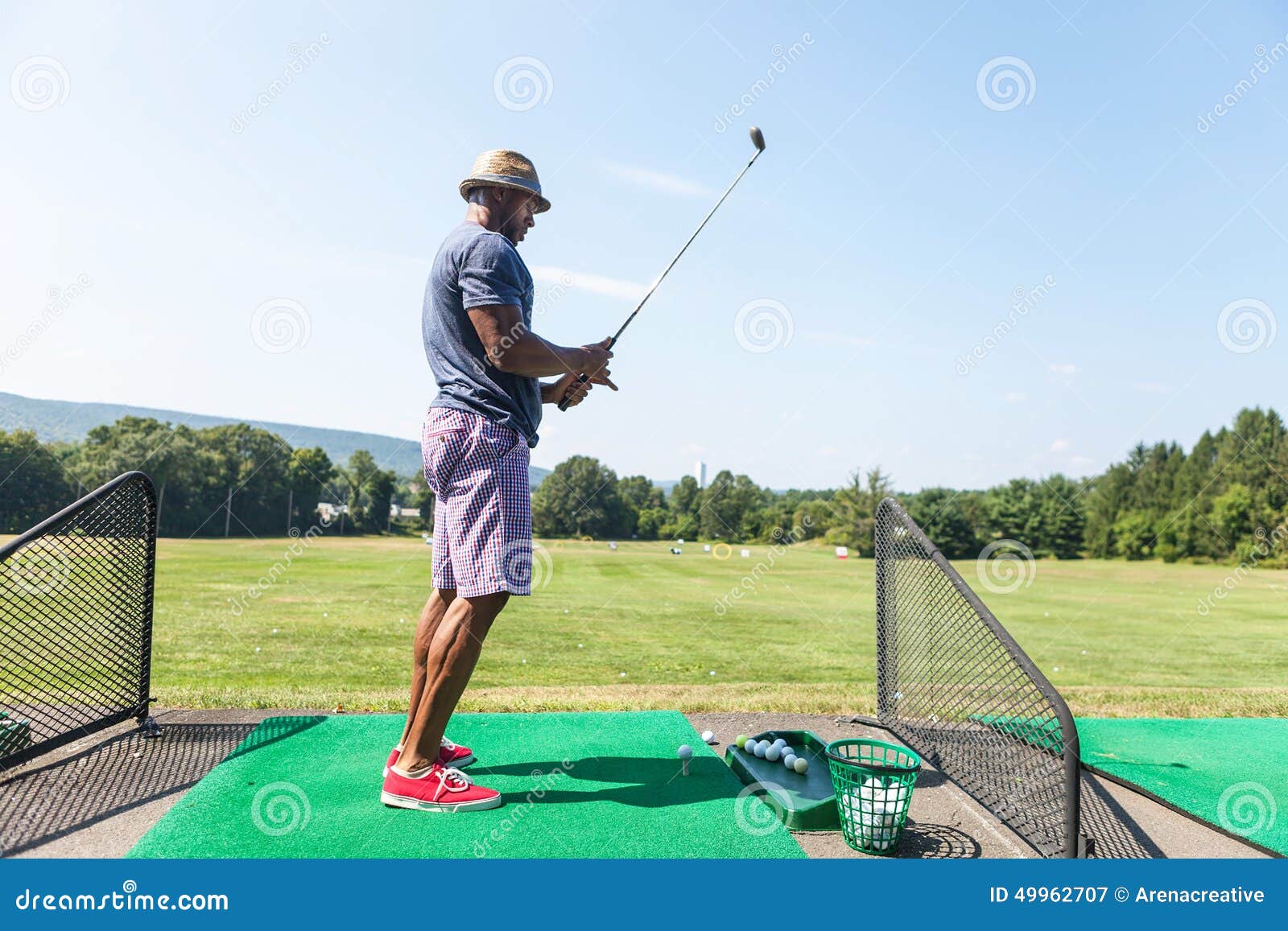 Golfer Teeing Up stock image. Image of golf, outdoors - 49962707