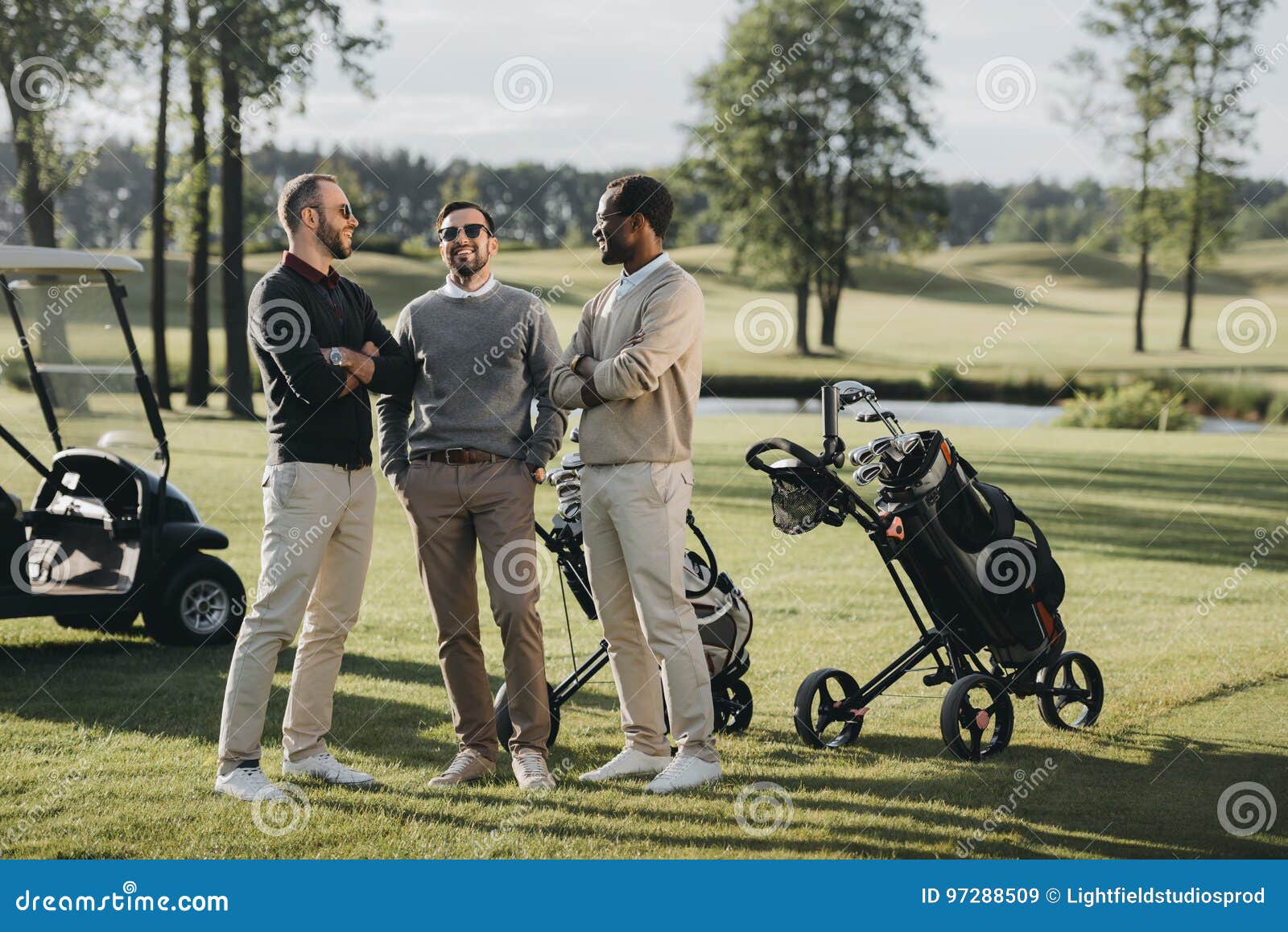 Golfers with Golf Clubs Talking and Spending Time Together on Golf ...