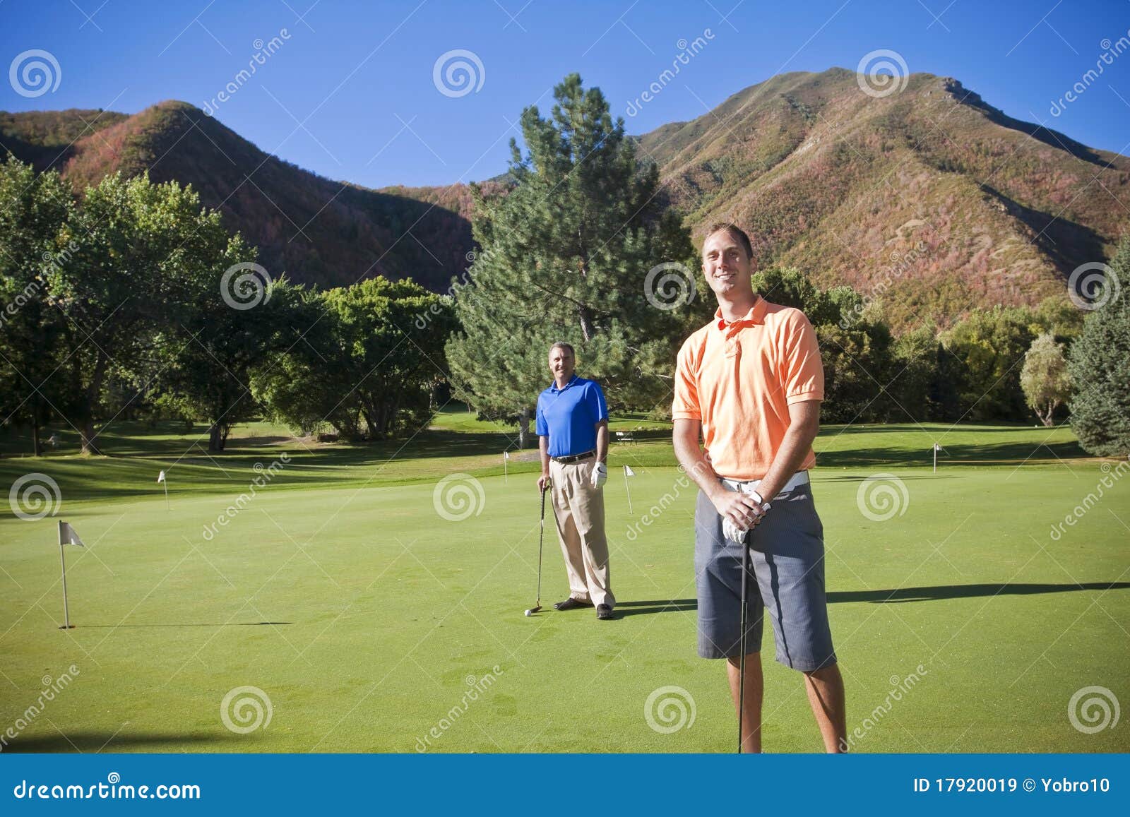 Golfers on the Golf Course stock image. Image of sports - 17920019