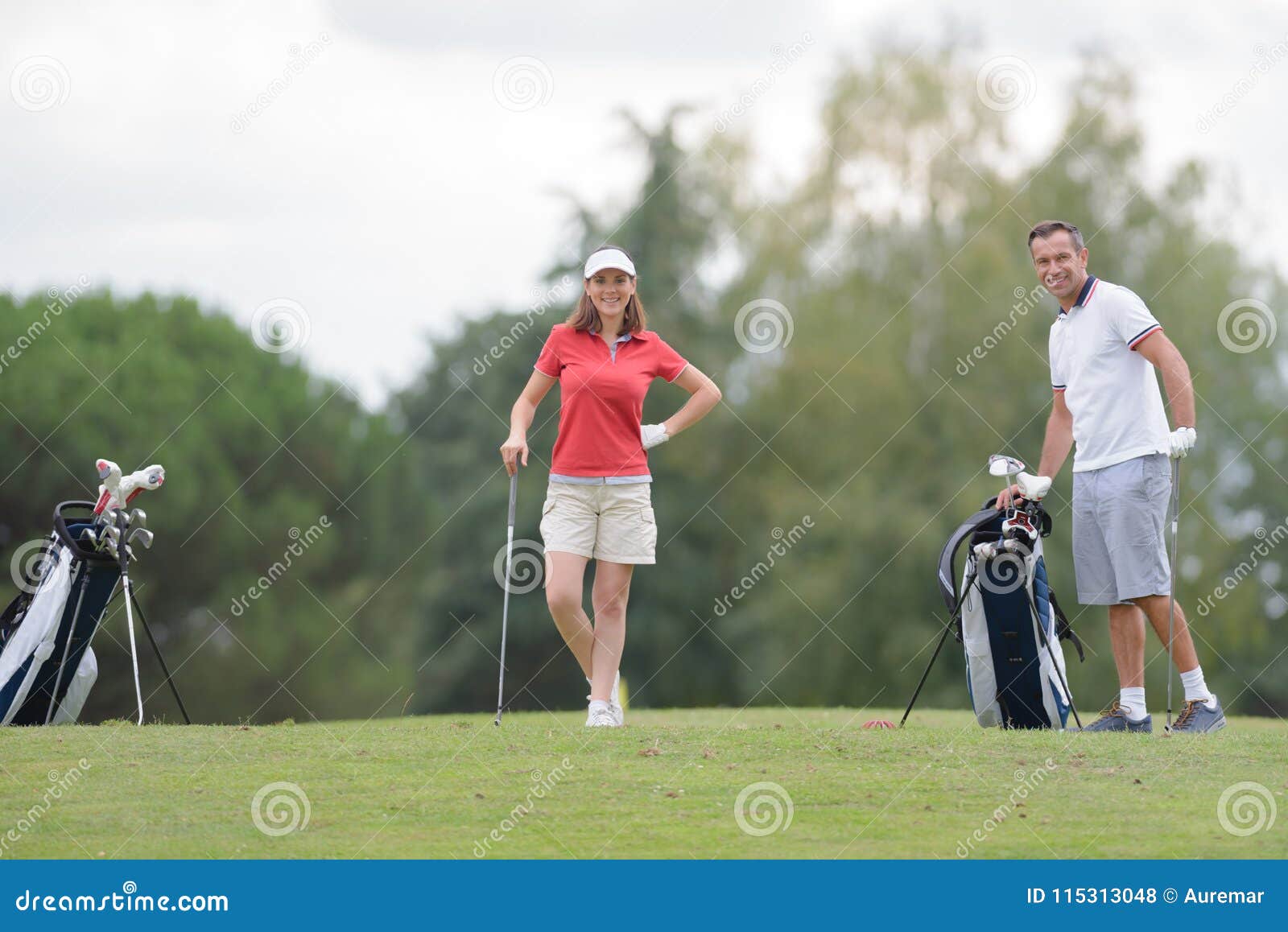 Golfers posing and smiling stock photo. Image of tree - 115313048