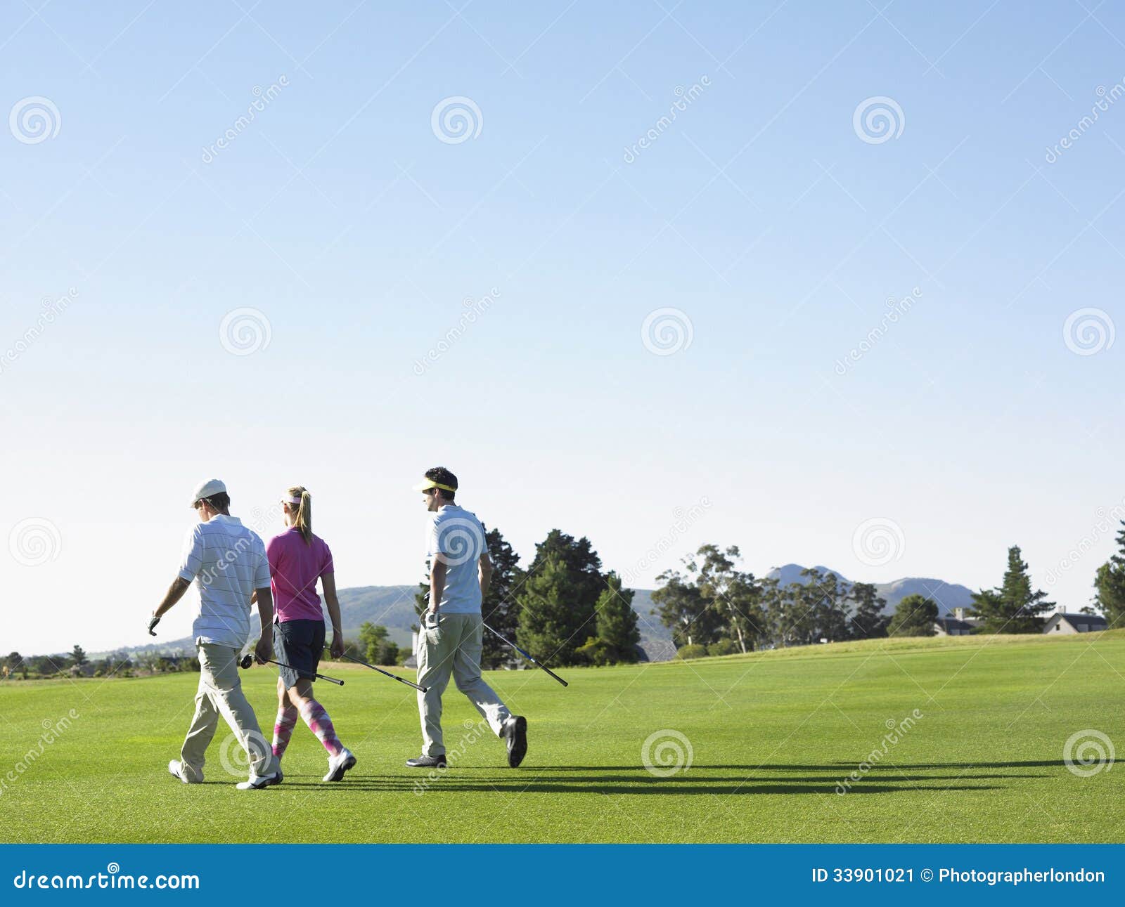 Golfers Walking on Golf Course Stock Image - Image of cape, rear: 33901021
