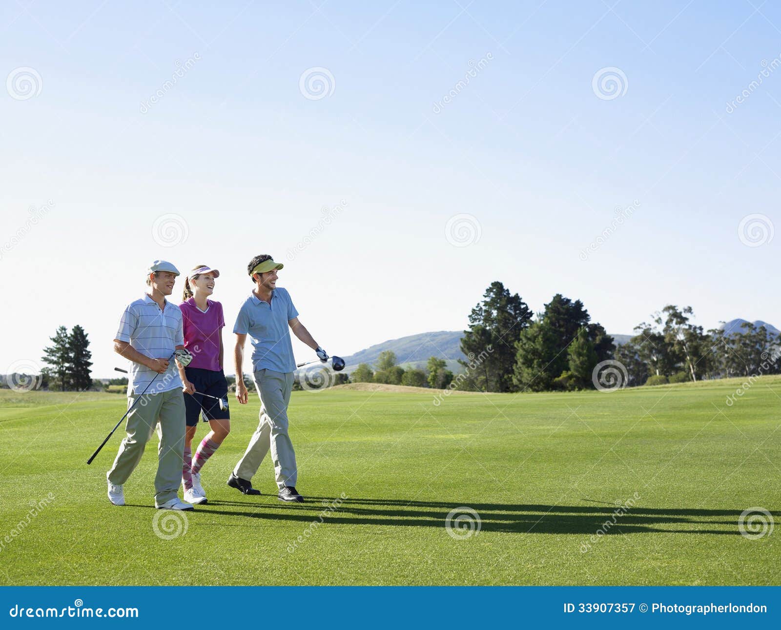 Golfers Walking on Golf Course Stock Image - Image of people, enjoyment ...