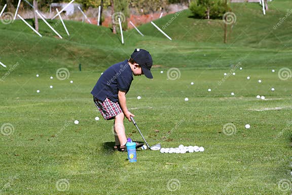 Golfing Boy stock photo. Image of driving, grass, swing - 340186