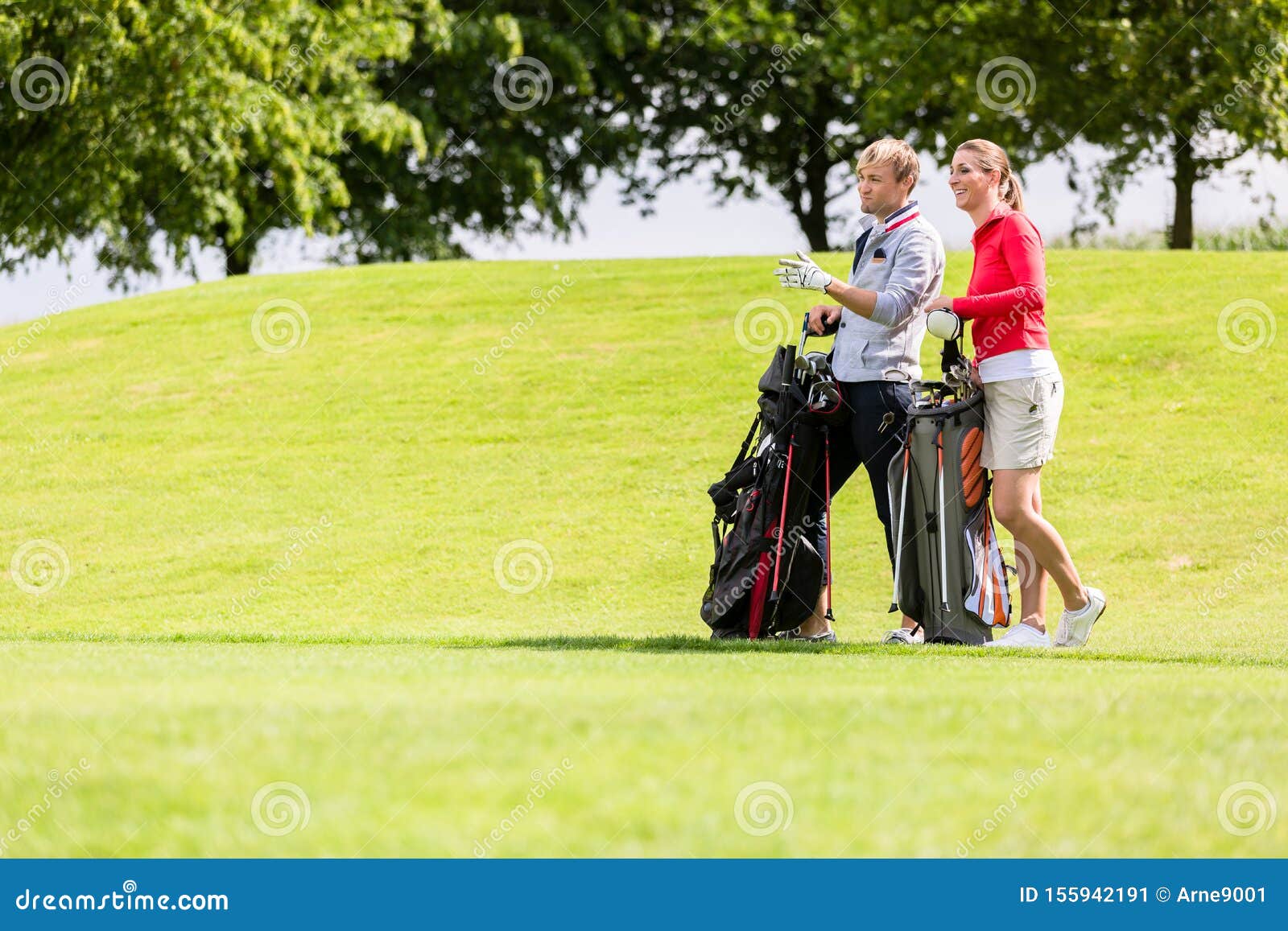 Golfing Couple at Golf Field Stock Image - Image of people, hobby ...