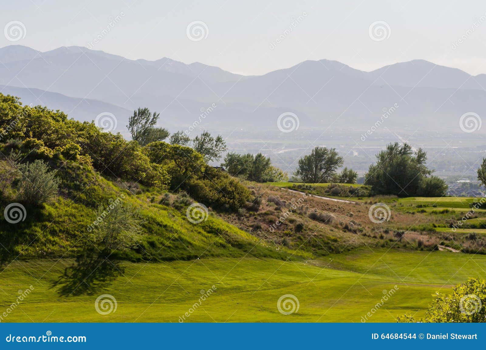 Golfing in layers stock photo. Image of utah, rocky, green - 64684544