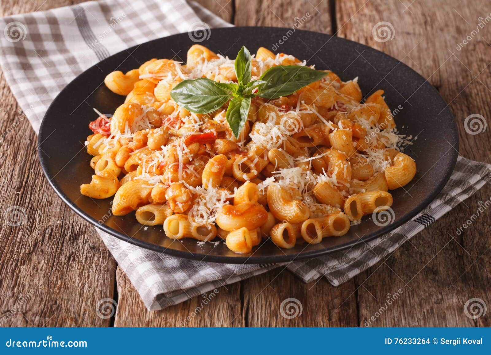 Gomiti Pasta with Tomatoes, Beans and Parmesan on a Plate Close- Stock ...