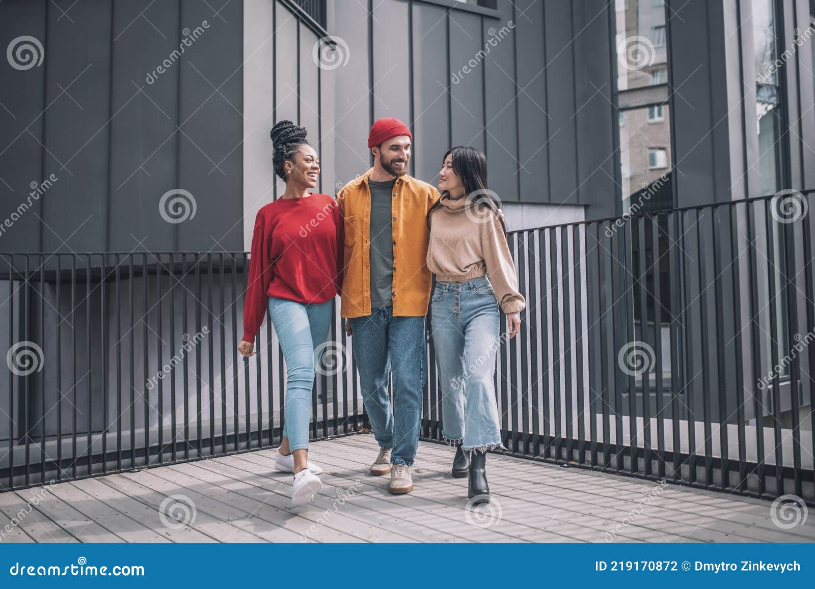 Three Friends Walking Together and Feeling Good Stock Photo - Image of ...