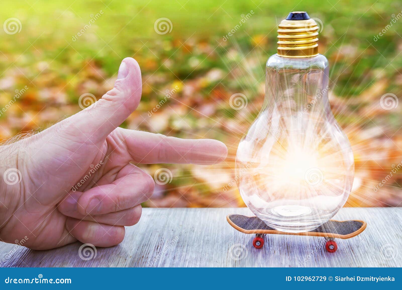 Good Idea Concept. Finger Points To Glowing Light Bulb that is on ...