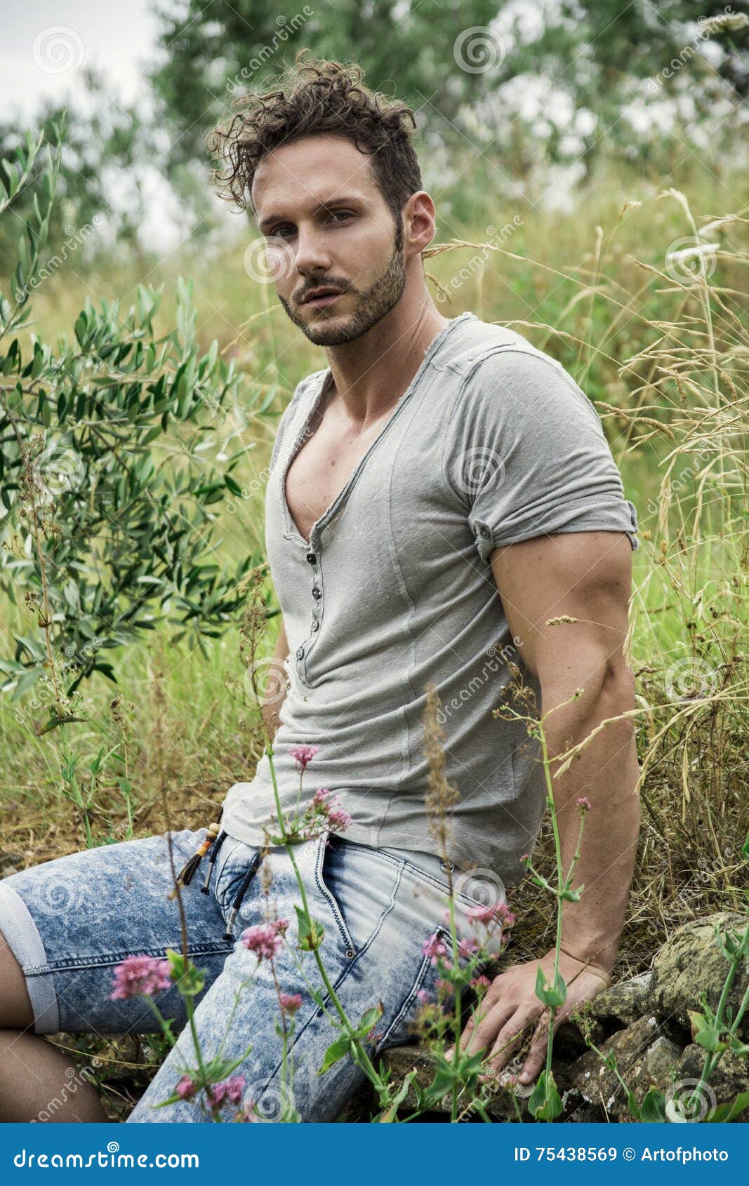 Good Looking Male Model Sitting on Grass Stock Image - Image of outdoor ...
