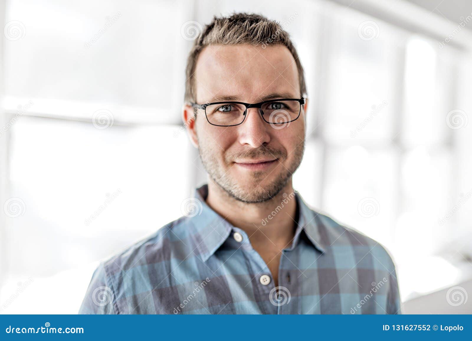 A Good Looking Man in Glasses, Portrait at Home Stock Photo - Image of ...