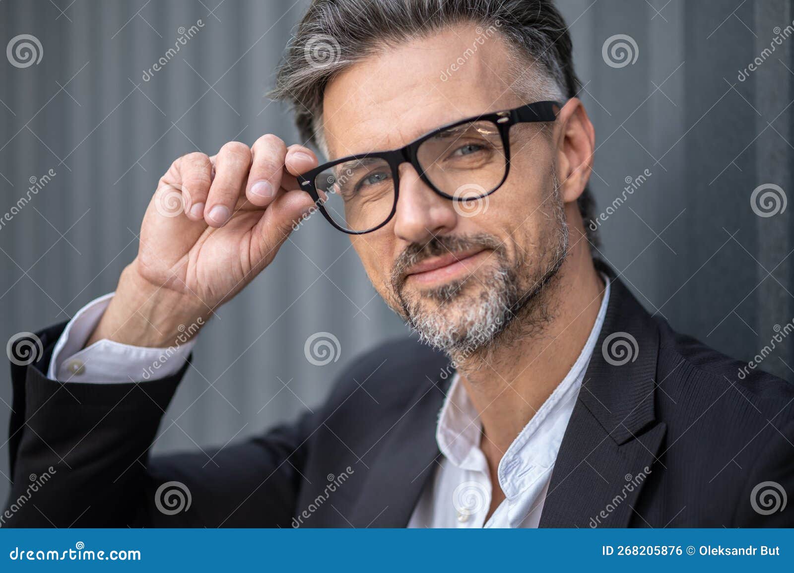 Good-looking Man in a Suit and Eyeglasses Looking Confident Stock Photo ...