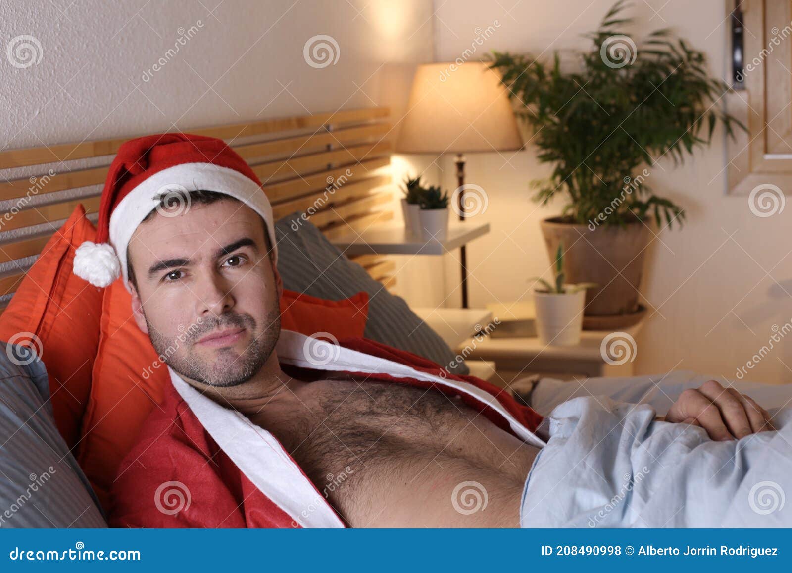 Good Looking Santa Claus in Bed Stock Photo - Image of beautiful, male ...