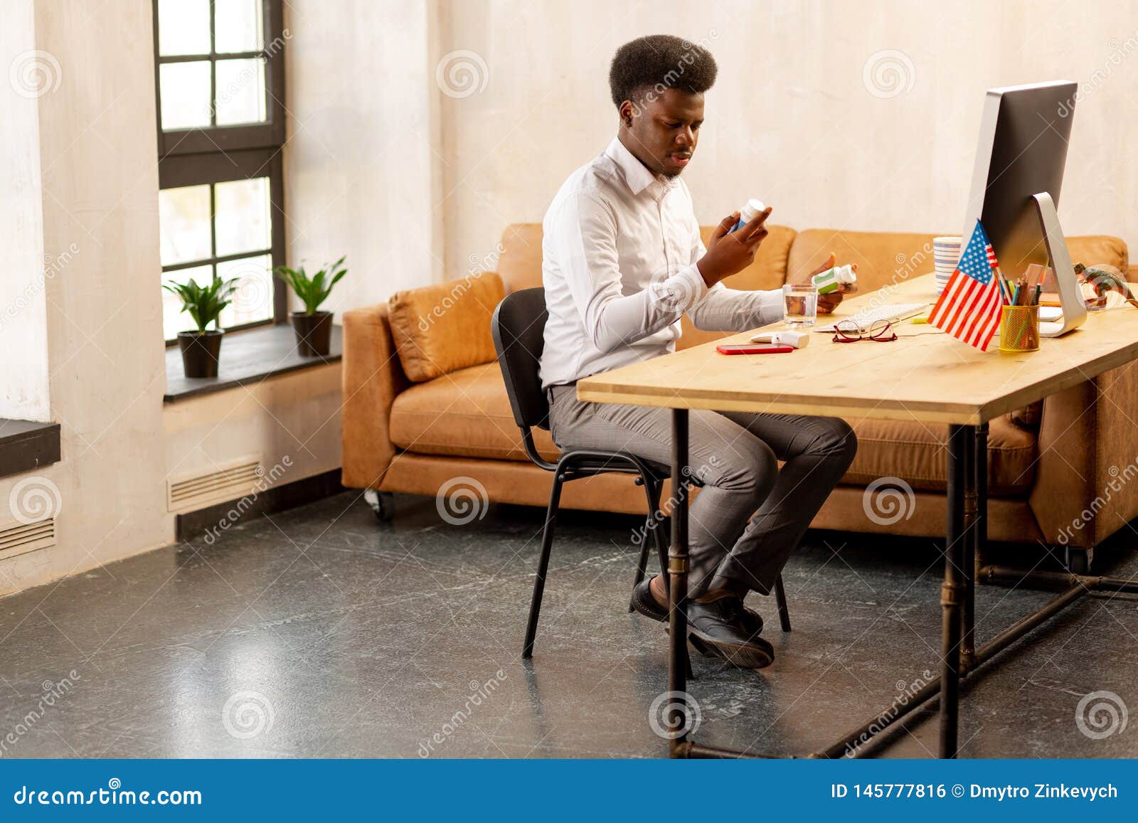 Good Looking Smart Man Sitting at the Table Stock Photo - Image of ...