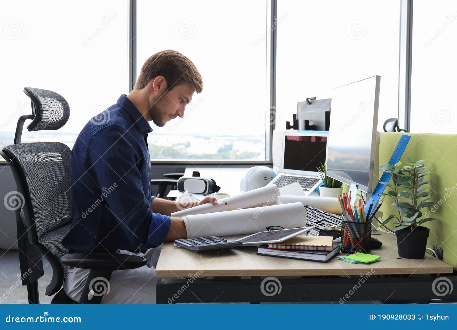 Good Looking Young Business Man Drawing Something while Working in the ...