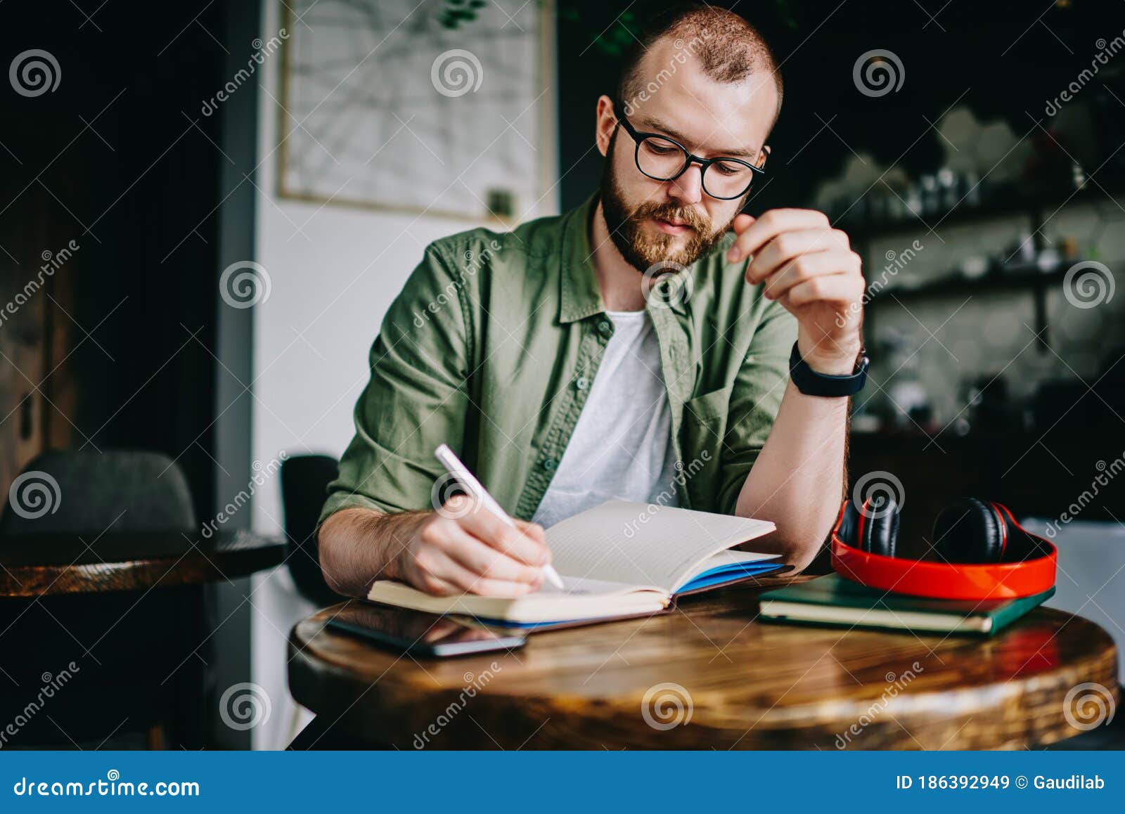 Handsome Creative Author Sitting at Cafe Interior with Notebook Stock ...