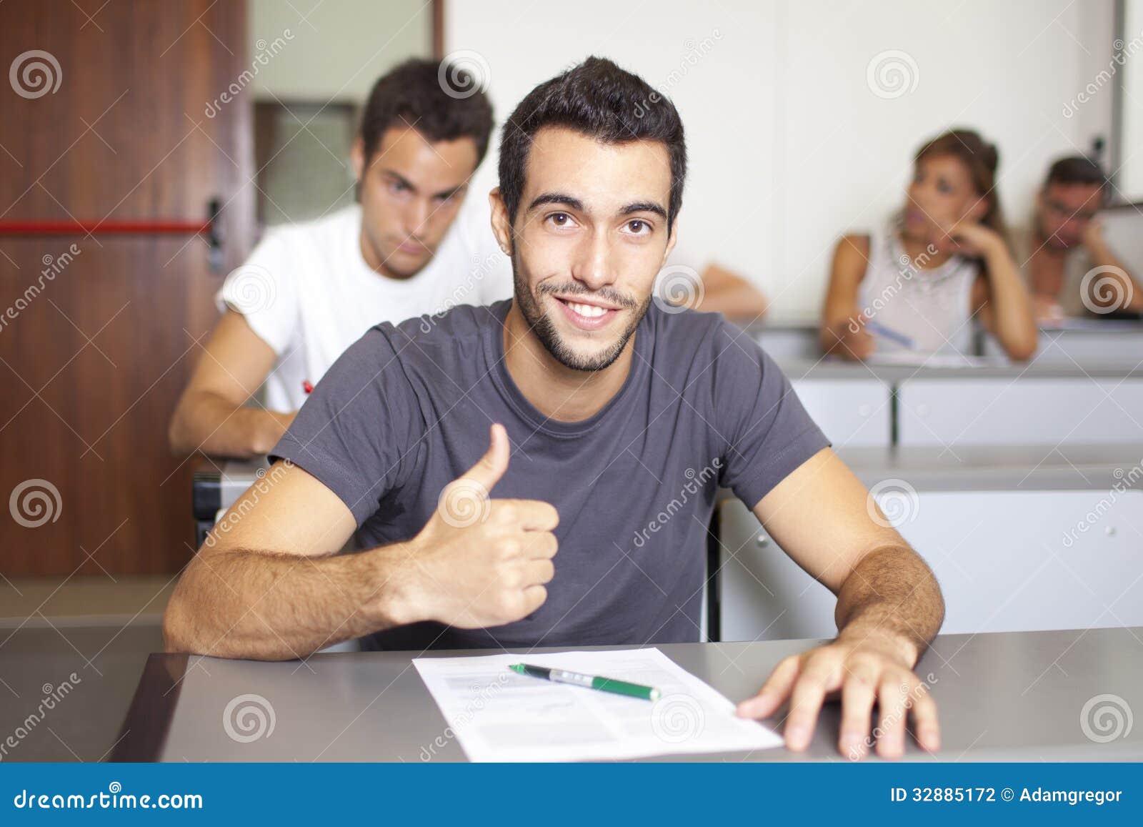 Good Looking Young Student in Class with Thumb Up Stock Photo - Image ...