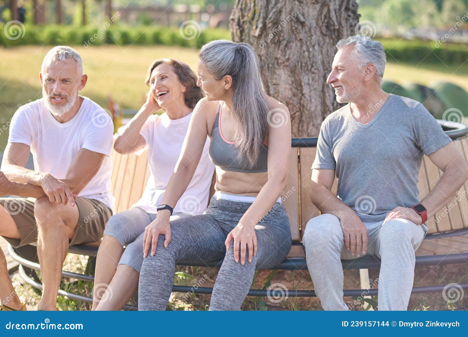 Group of People Resting after the Workout and Feeling Joyful Stock ...
