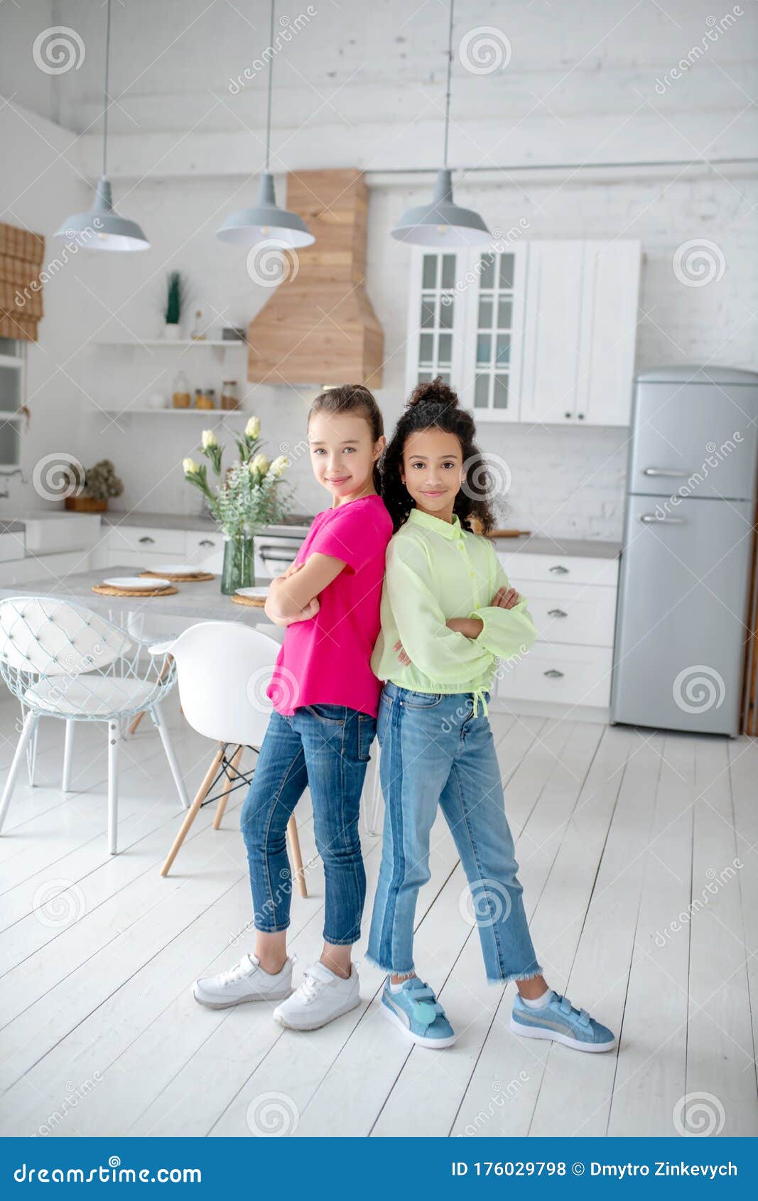Two Friends Standing in the Kitchen Looking Joyful Stock Photo - Image ...