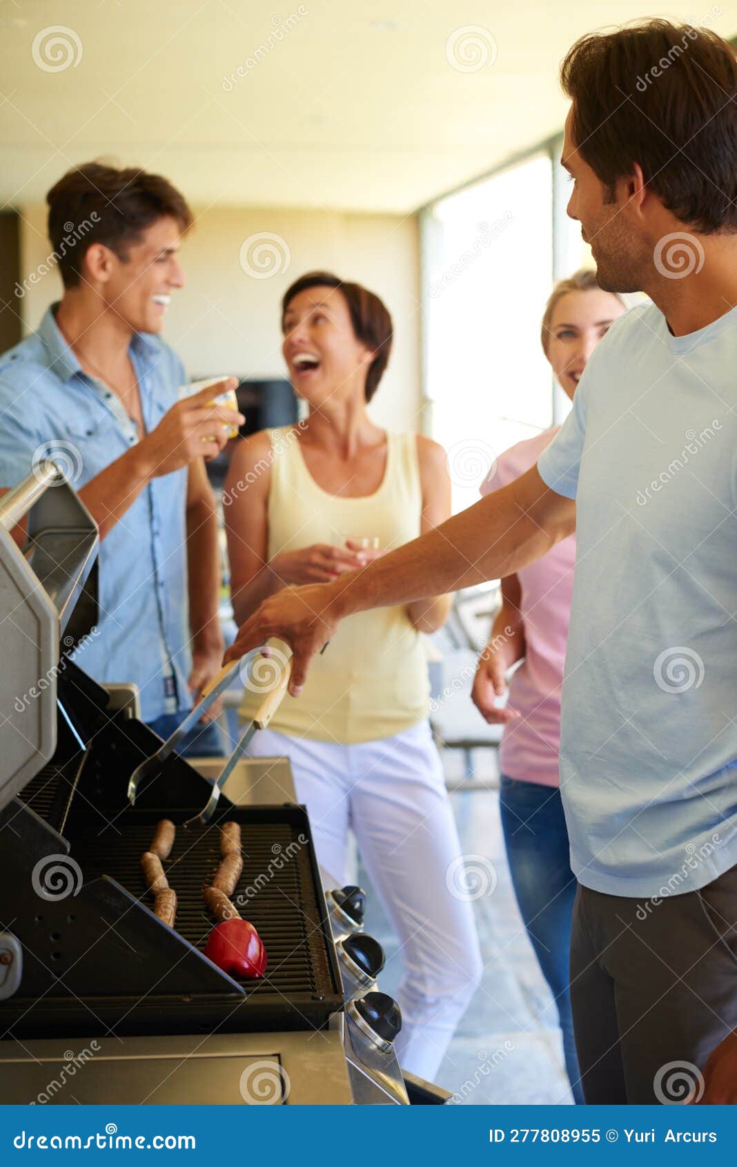 Good Times. a Group of Young Friends Enjoying a Barbeque. Stock Image ...