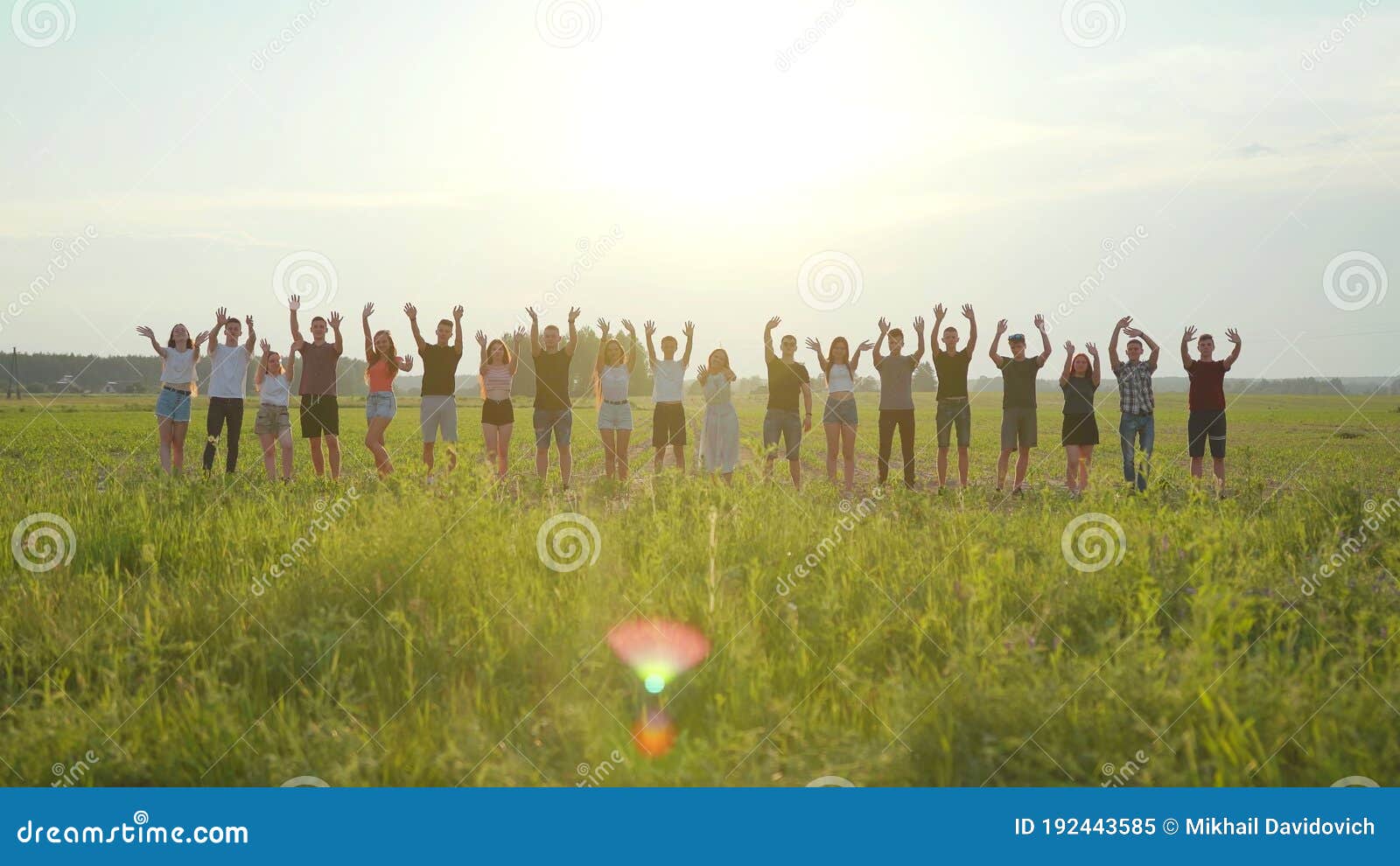 Goodbye Concept. a Large Group of Students Wave Their Hands at Sunset ...