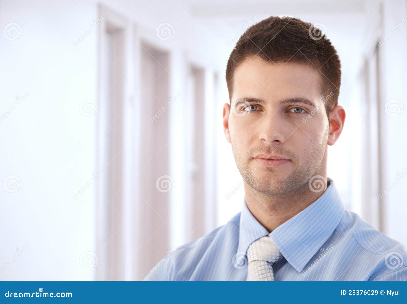 Goodlooking Businessman Standing in Hallway Stock Image - Image of ...