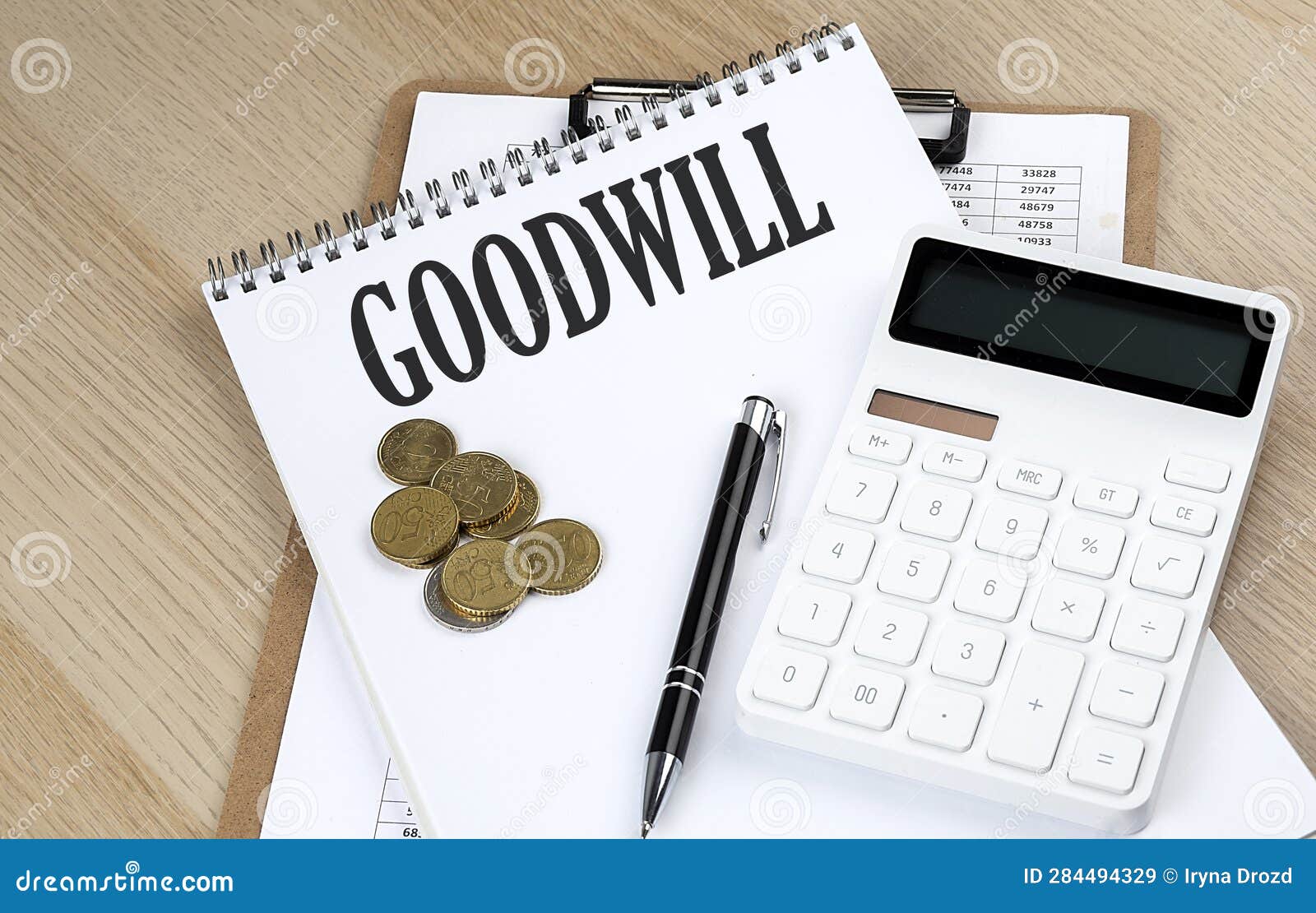 GOODWILL Text with Chart and Calculator and Coins , Business Concept ...