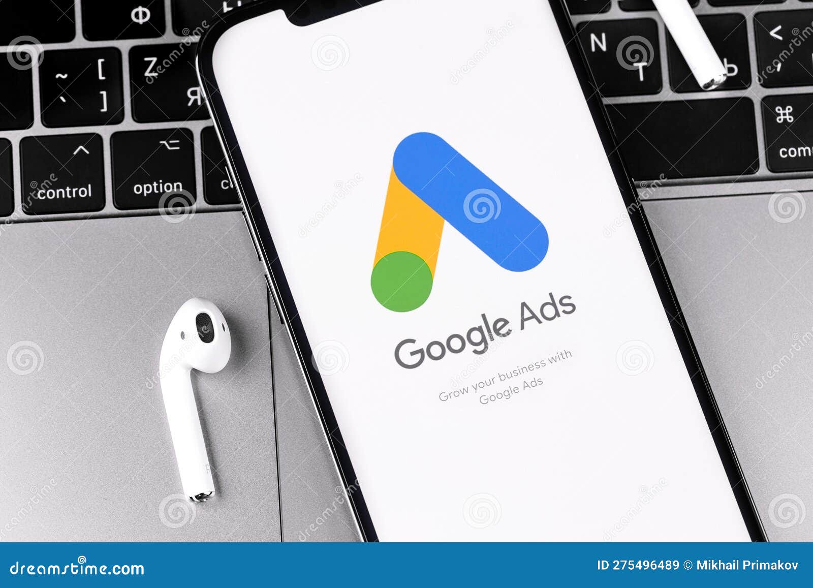 Google Ads Logo Mobile App on the Screen Smartphone IPhone with AirPods ...