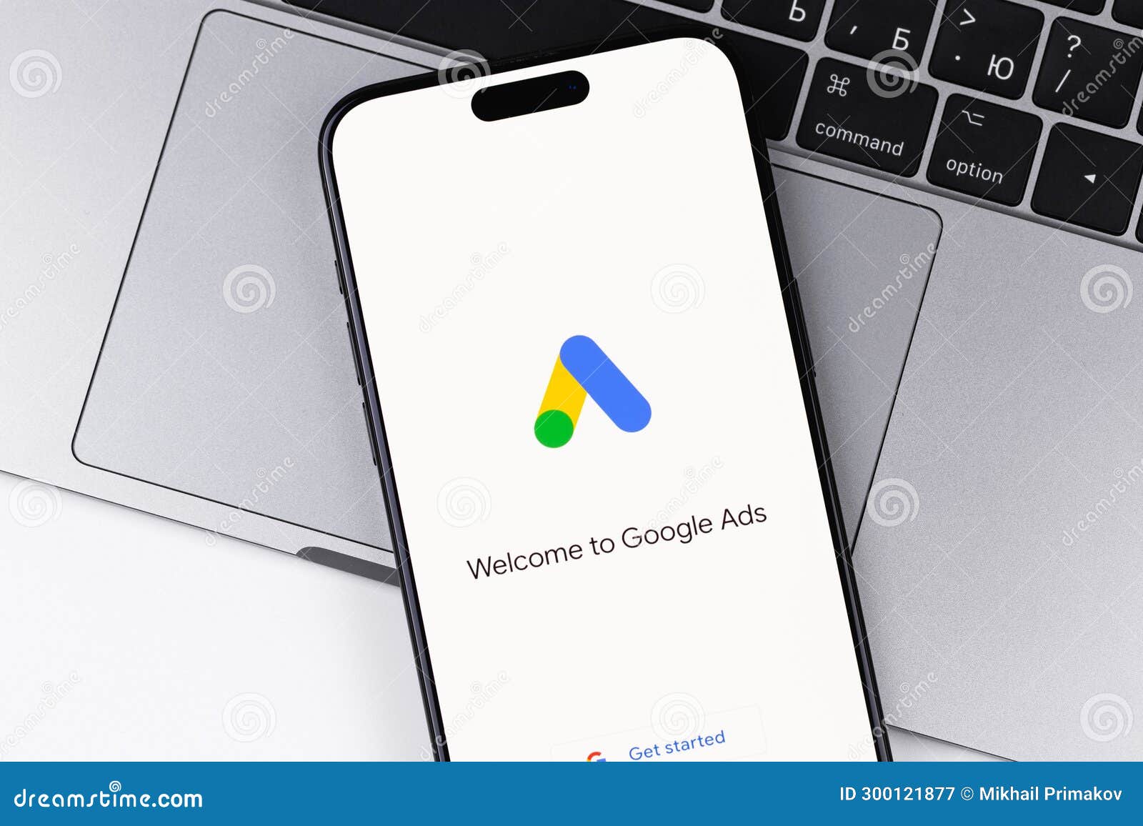 Google Ads Logo Mobile App on a Screen Smartphone IPhone with MacBook ...