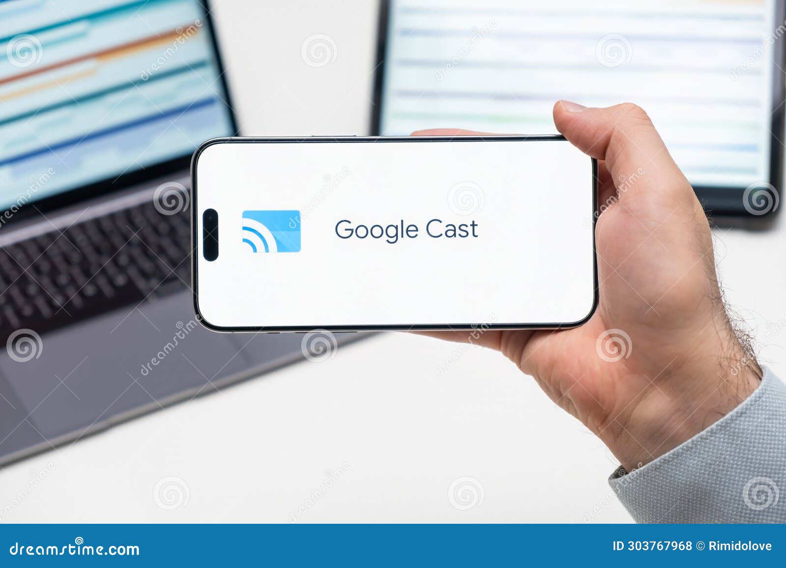 Google Cast Logo of App on the Screen of Mobile Phone Held by Man in ...