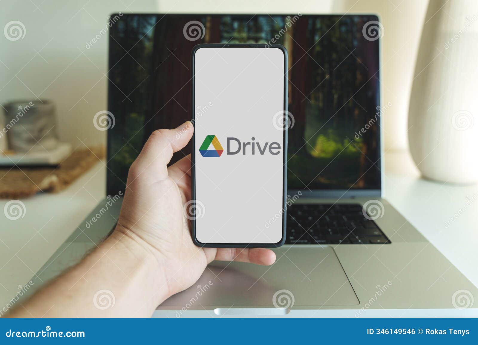 Google Drive Application Logo on Smartphone Screen in Front of Laptop ...