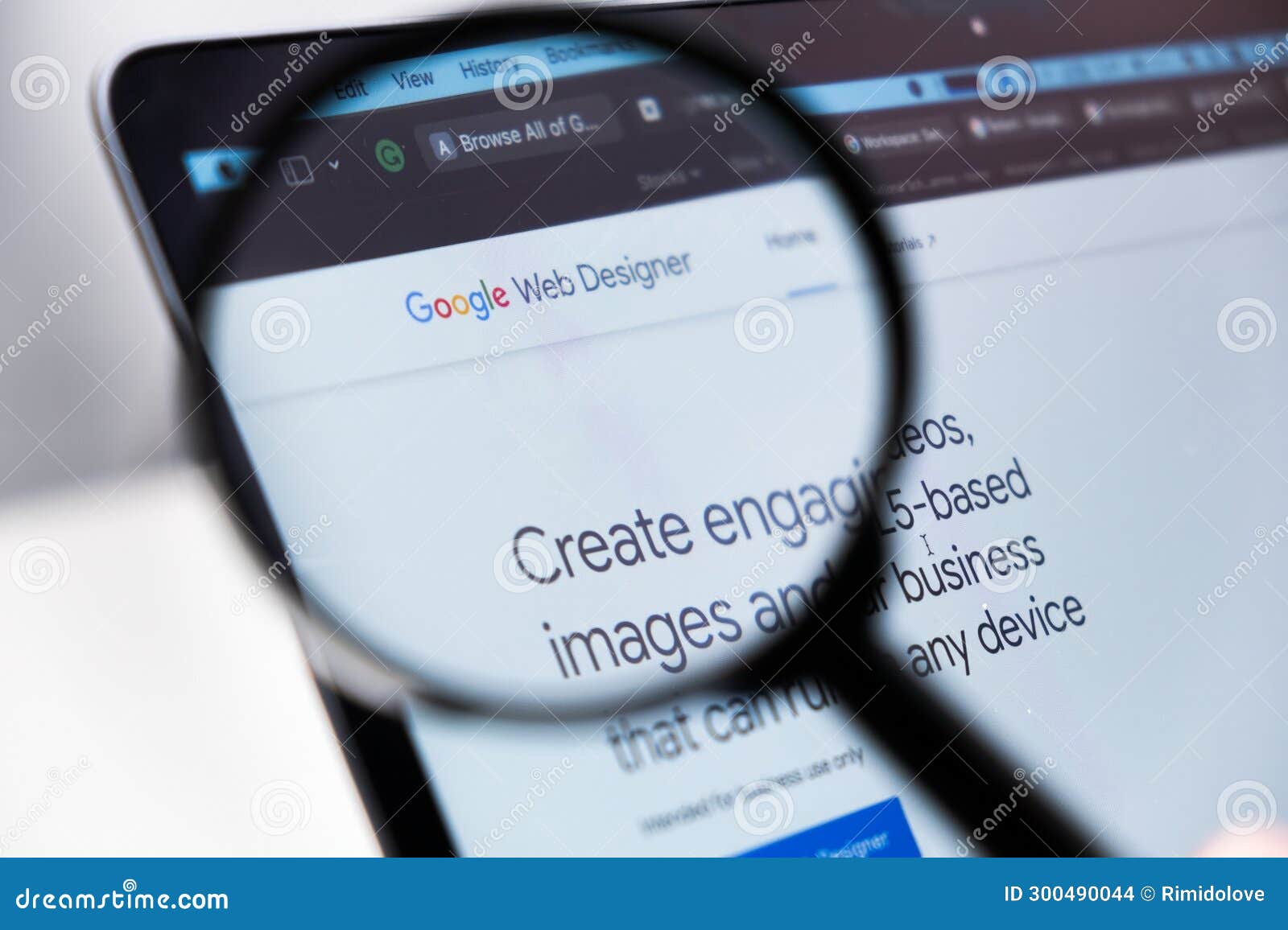 Google Web Designer Logo Enlarged through a Magnifying Glass on a ...