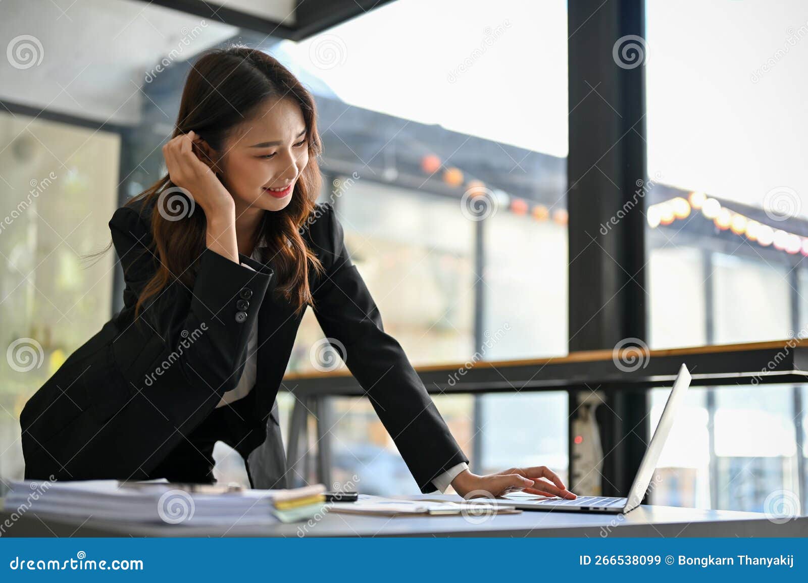 Gorgeous Asian Business Leaning on Table, Using Laptop Computer ...
