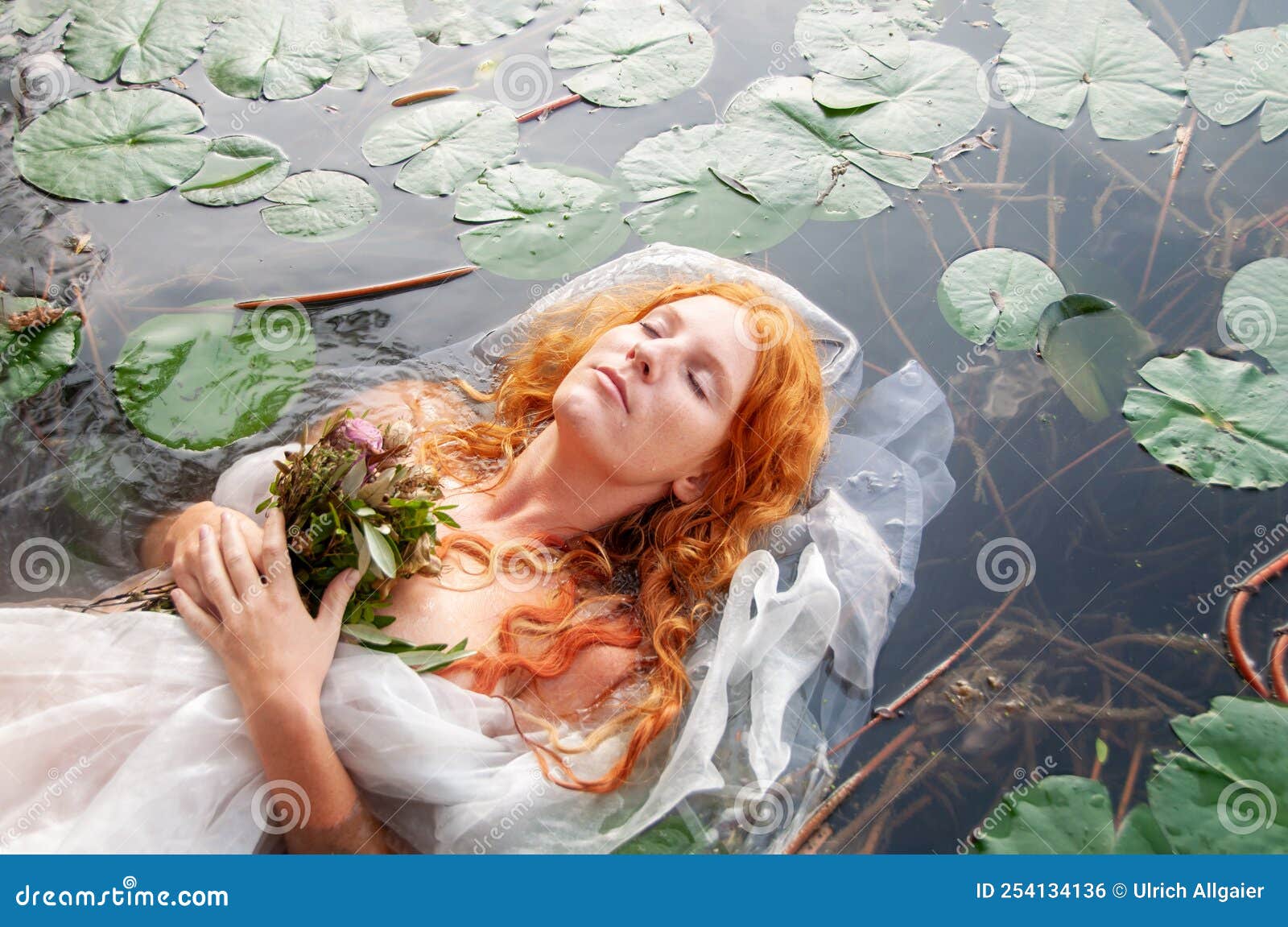 Gorgeous Beautiful Seductive Portrait Of A Young Sexy Woman Ophelia With Curly Red Hair Lying