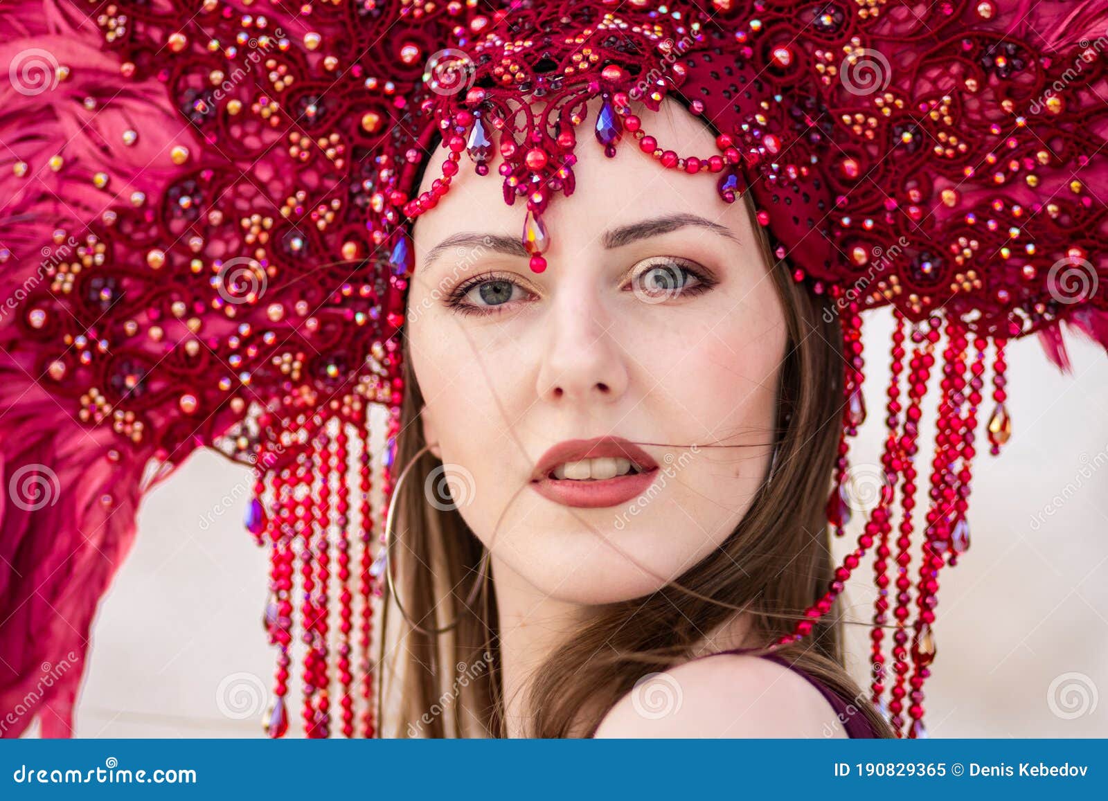 A Gorgeous Beautiful Young Woman in a Red Feather Crown Stock Image ...