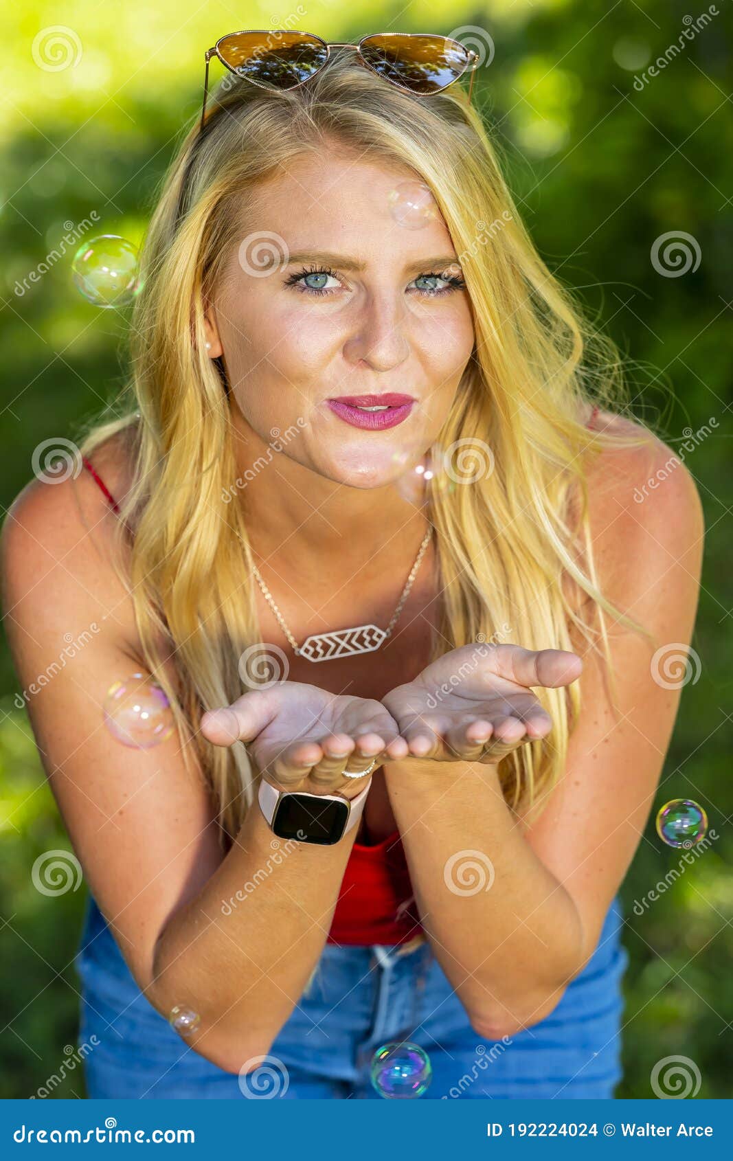 A Lovely Blonde Model Poses Outdoors While Enjoying A Summers Day Stock