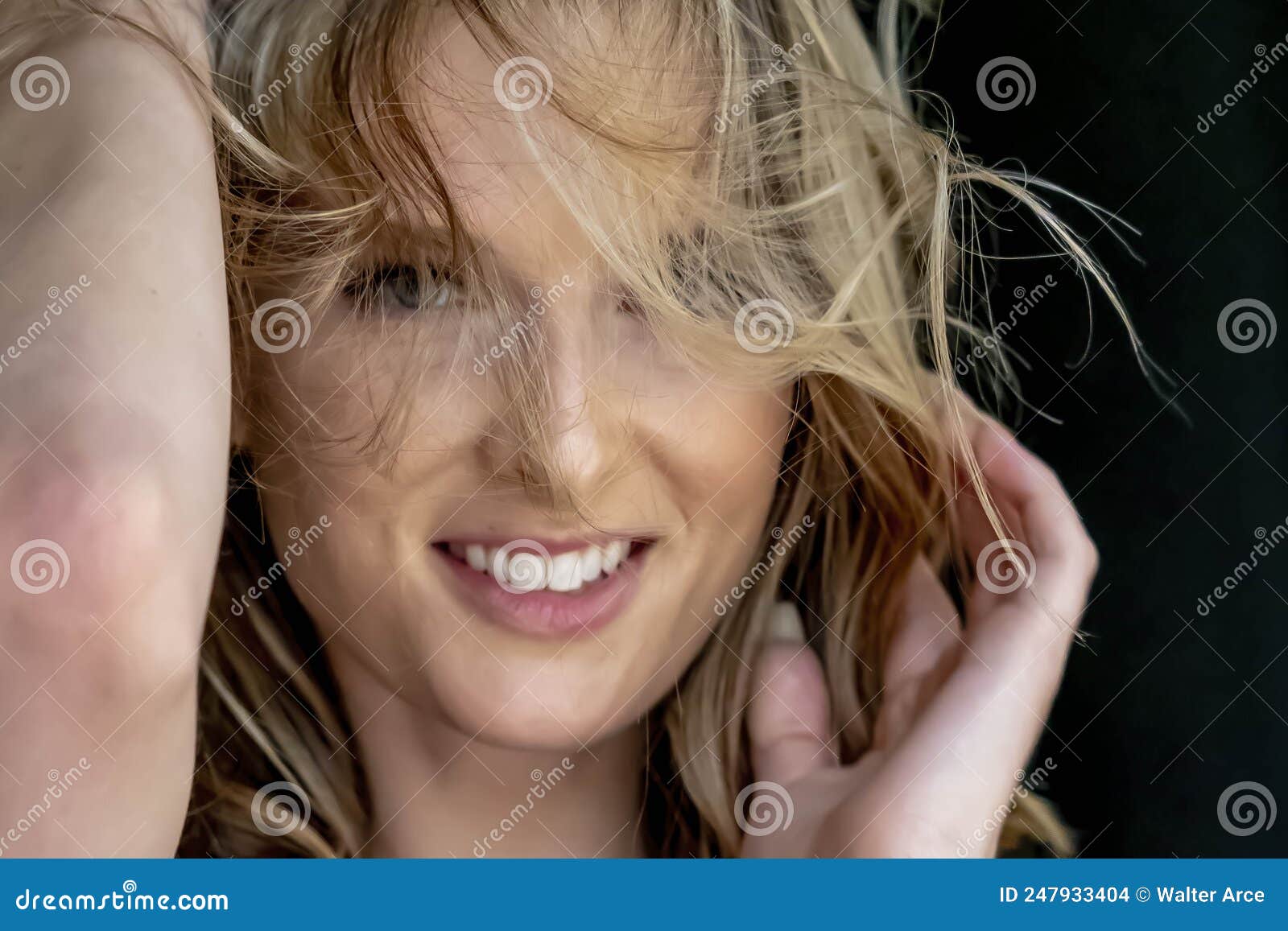 A Lovely Blonde Model Poses Outdoor While Enjoying The Spring Weather