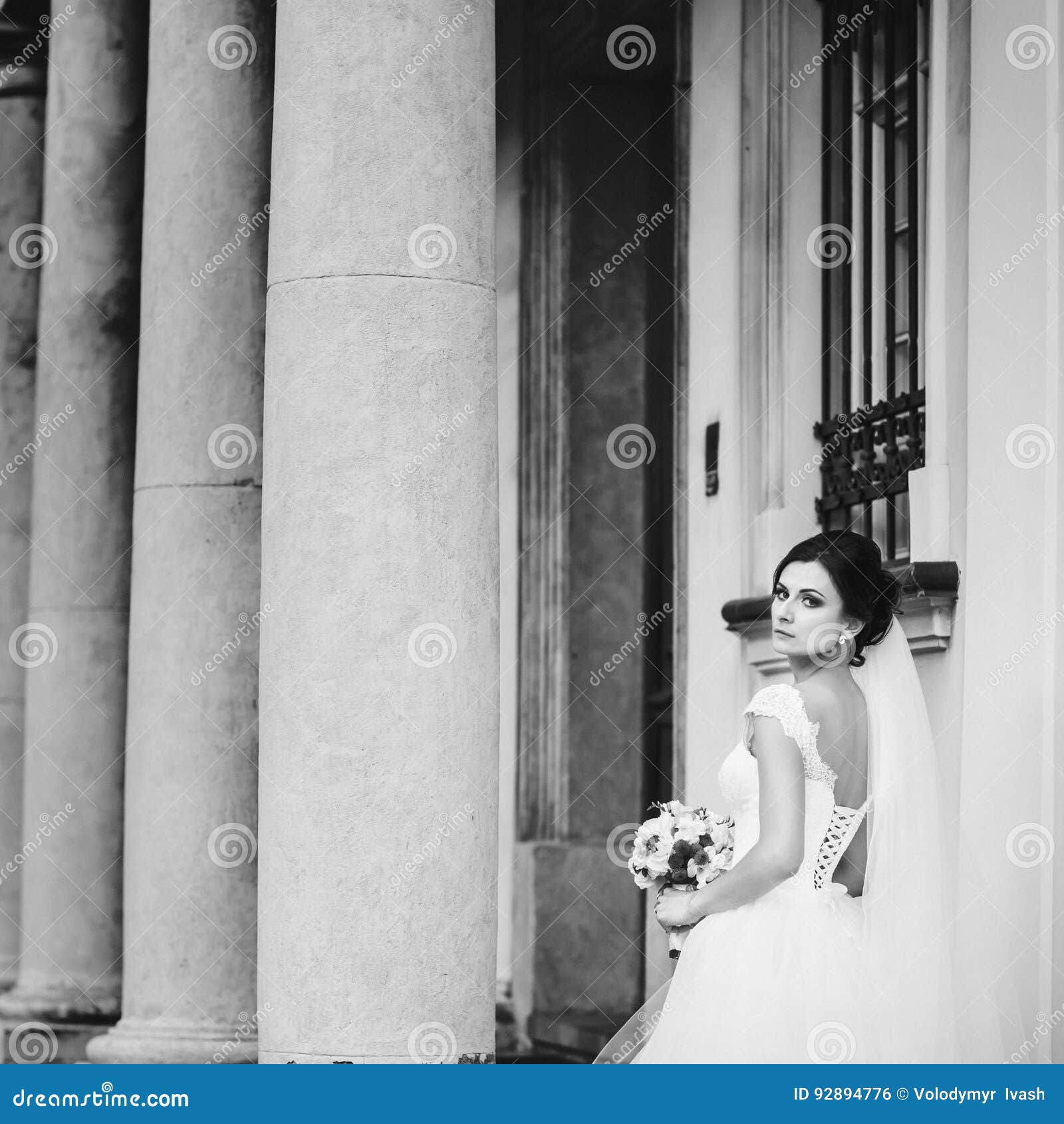 Gorgeous Bride Poses between Pillars of the Old Building Stock Photo ...