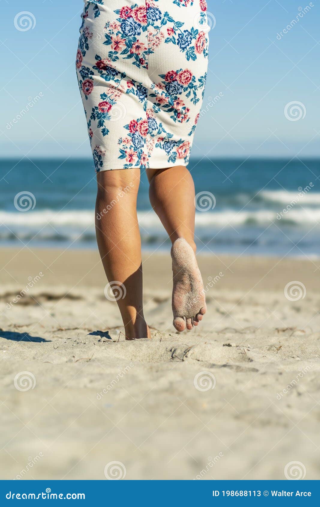 Beautiful Bikini Model Walks On The Beach Near The Shoreline Stock