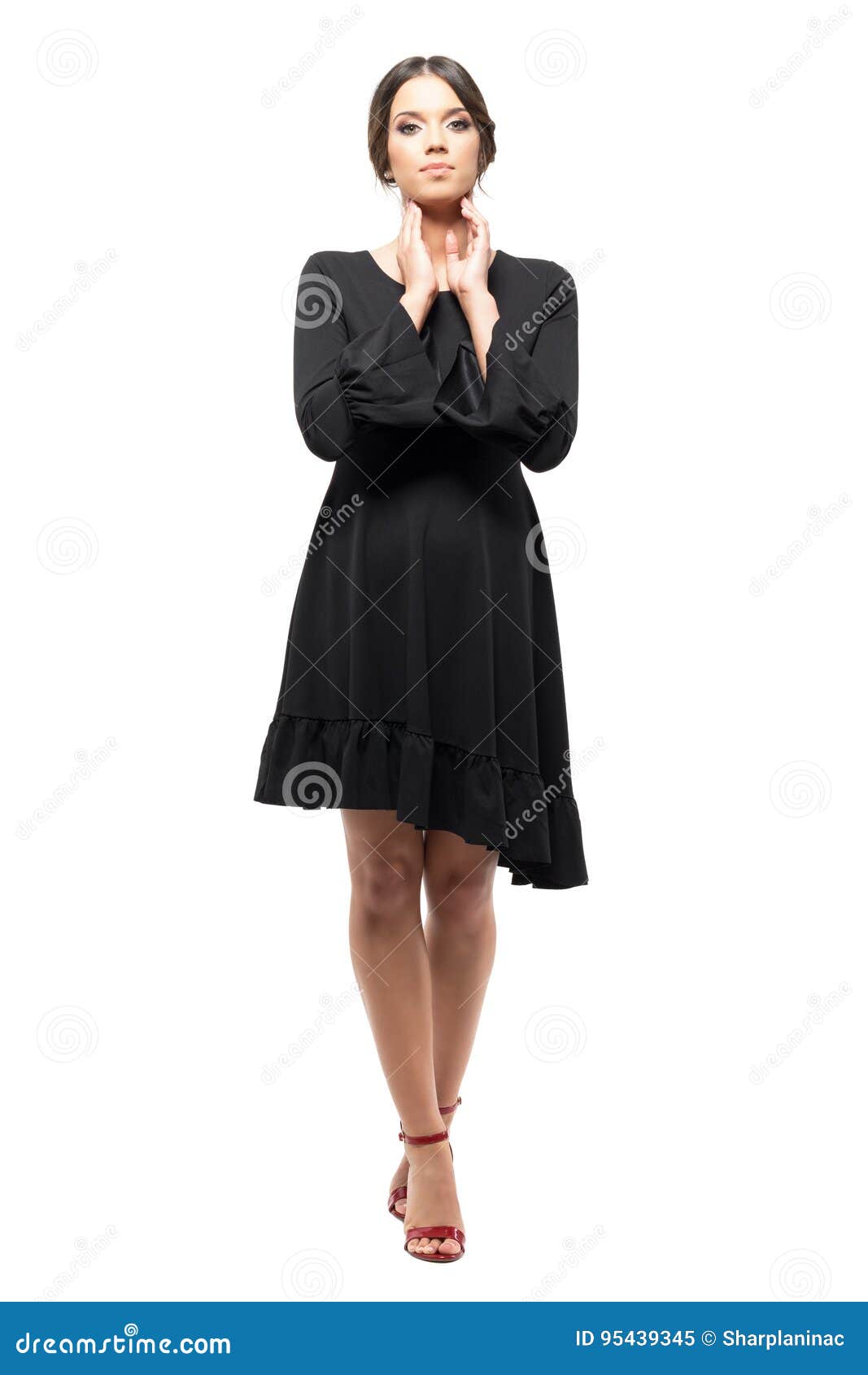 Gorgeous Seductive Latin Woman In Flounce Black Dress With Hands Touching Her Face Stock Image